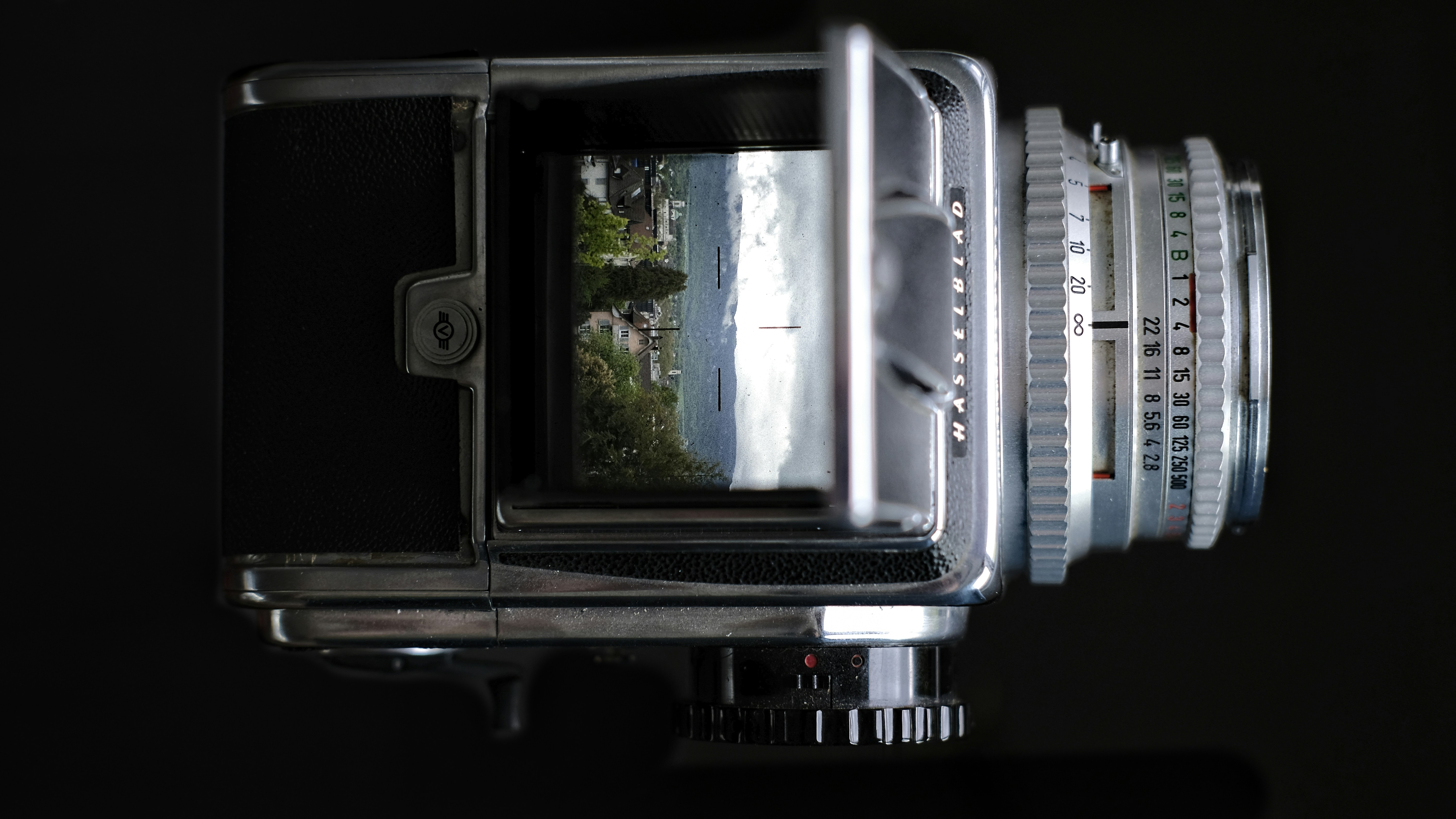 Backglass in Twilight: A Vintage SLR in Shadow