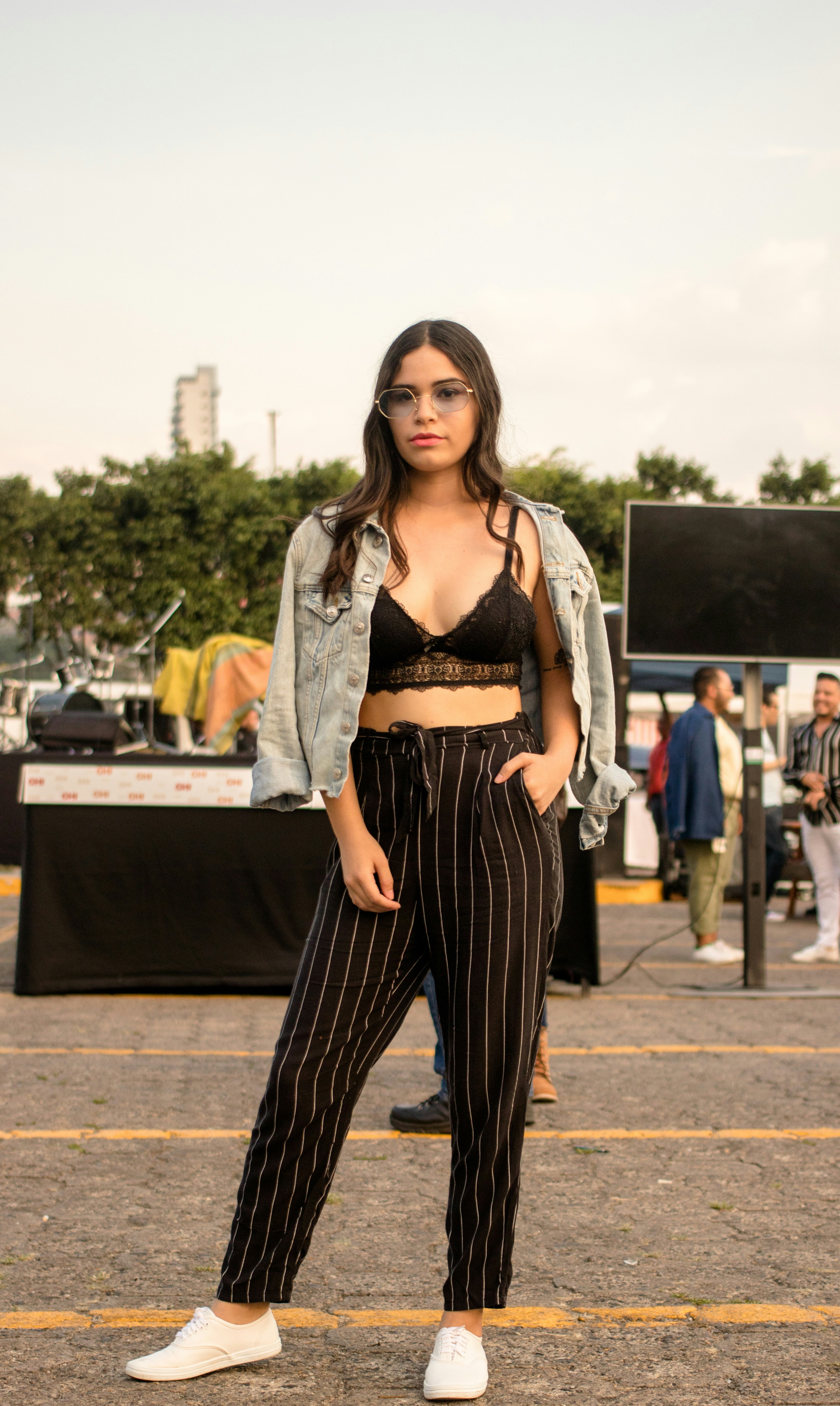 Lace and Pinstripes Under Streetlight: A Parking-Lot Runway Moment