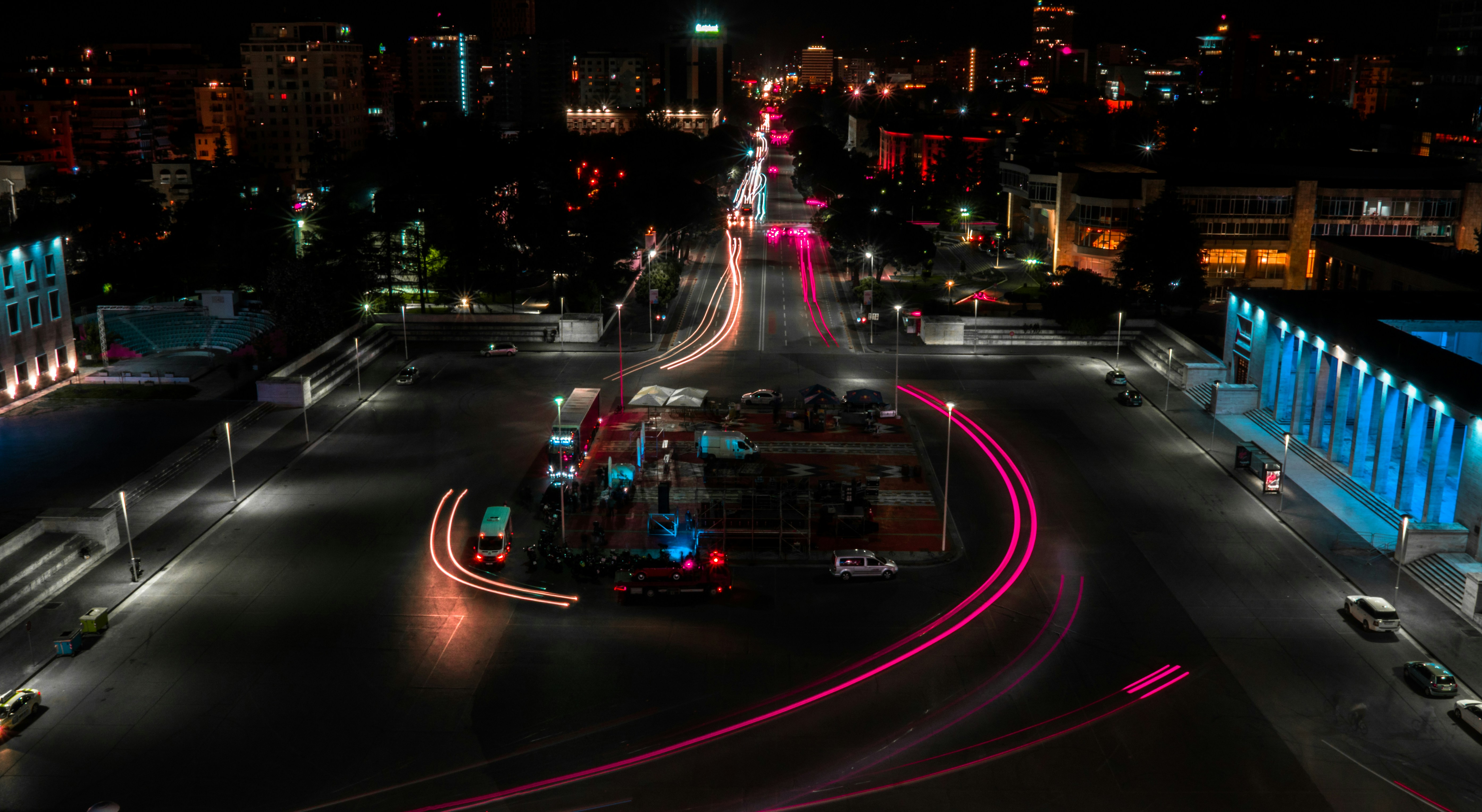Neon Ring Run: Aerial Night at the Pink-Light Roundabout