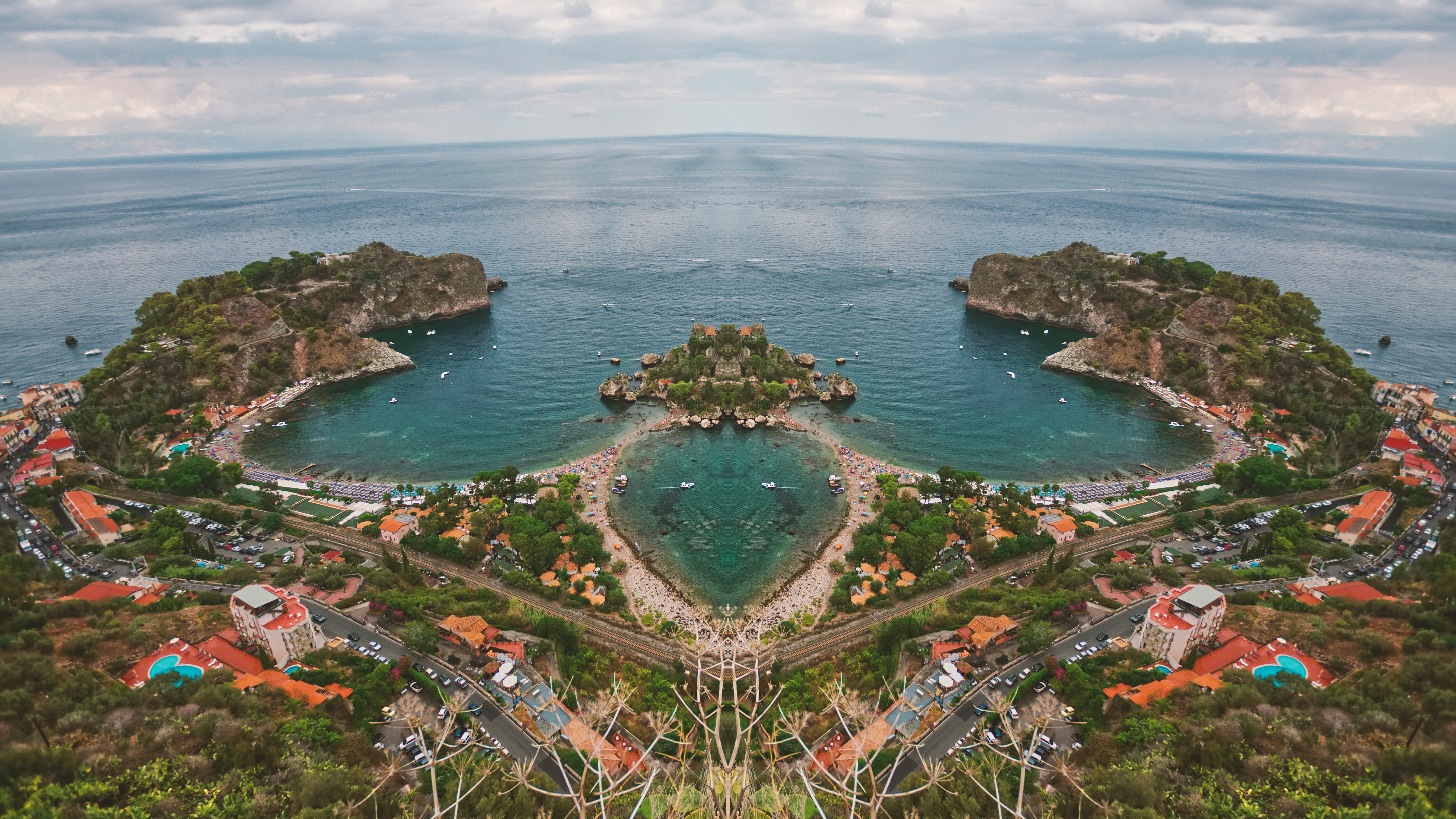 Symmetric Harbor: Aerial Mirror of a Coastal Village