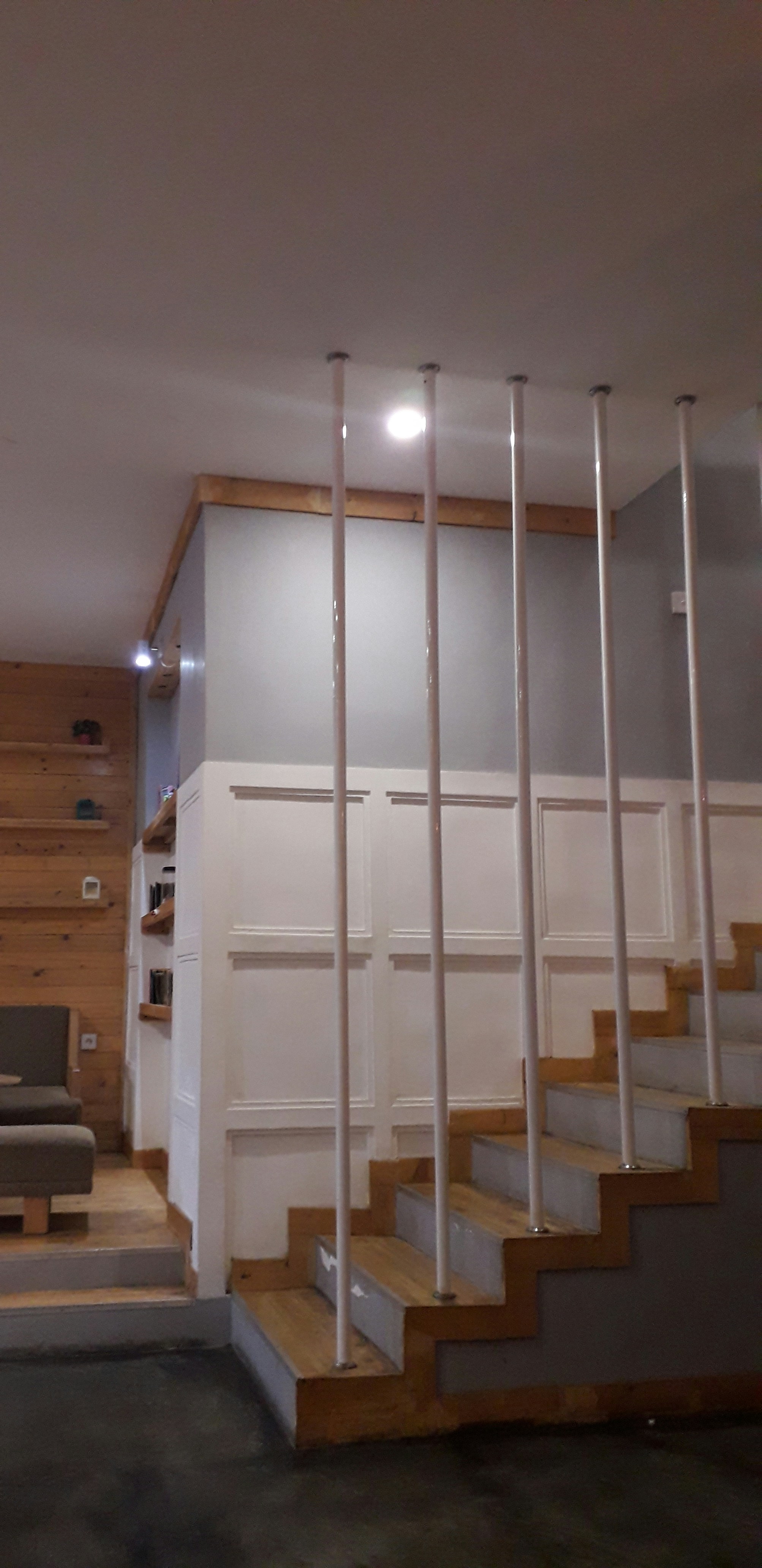 Rhythms of Steel: A Staircase Framed by Warm Interior Light