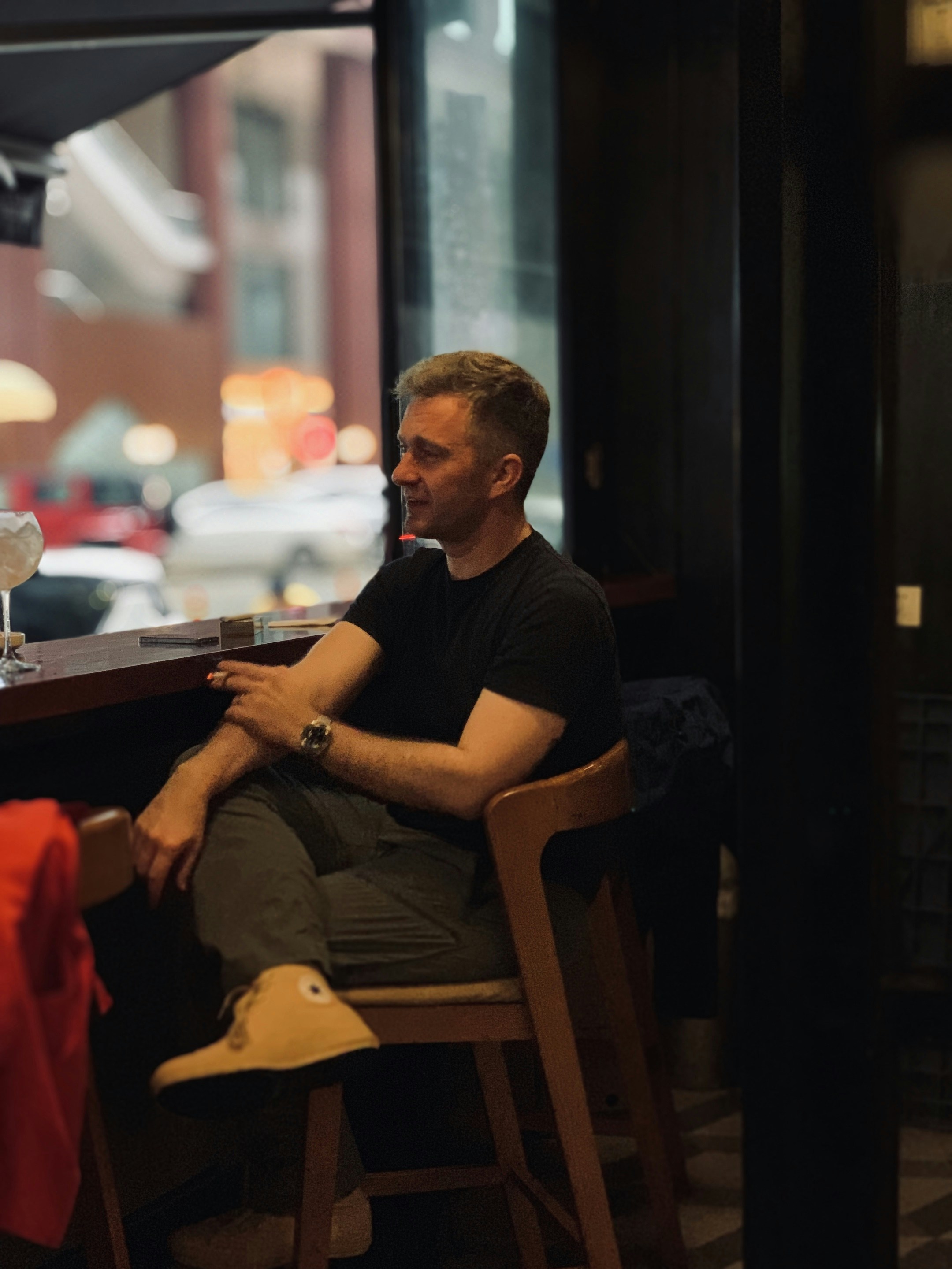 Man sitting on bar chair beside counter photo – Free Black Image on ...