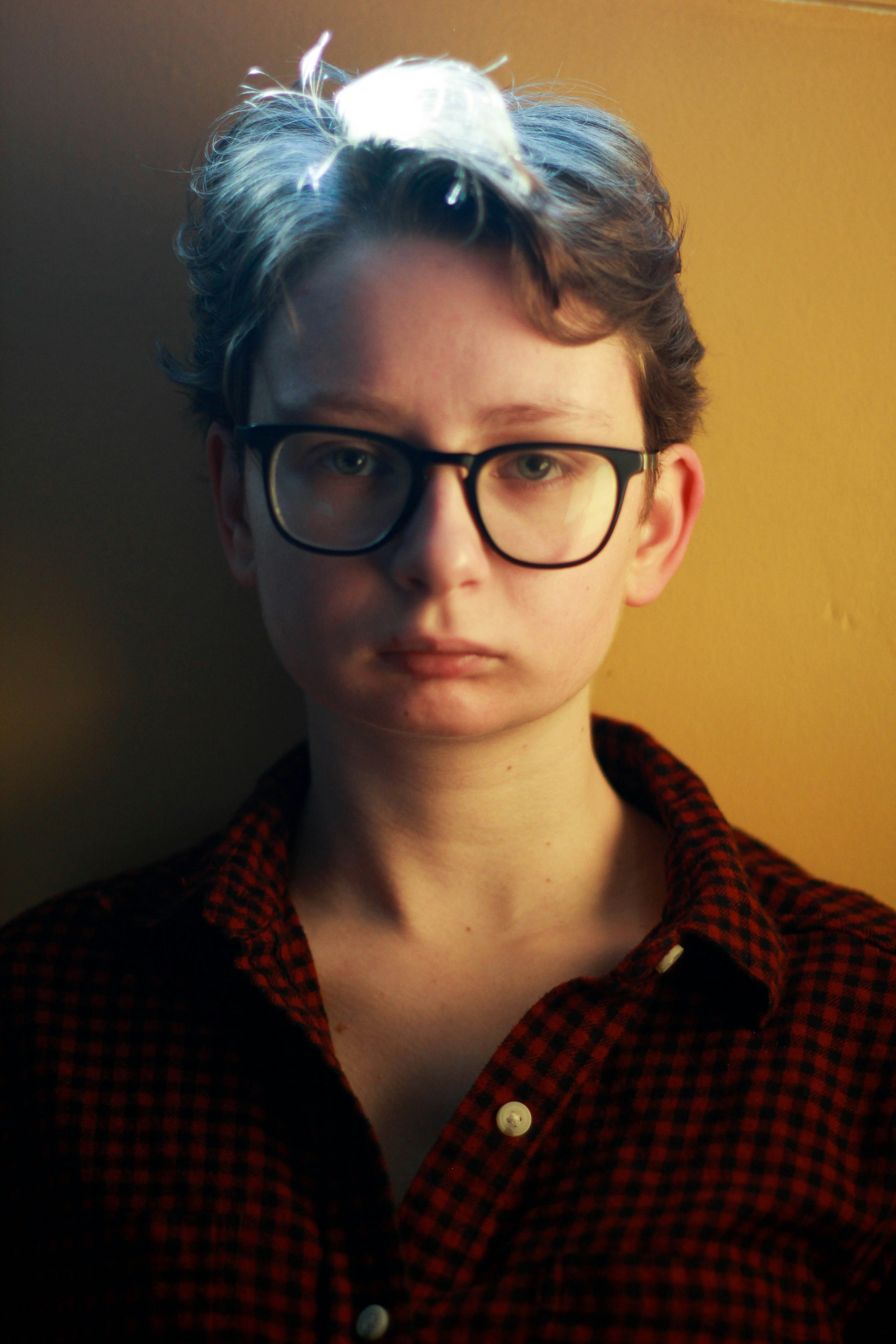 Woman standing beside wall photo – Free Glasses Image on Unsplash