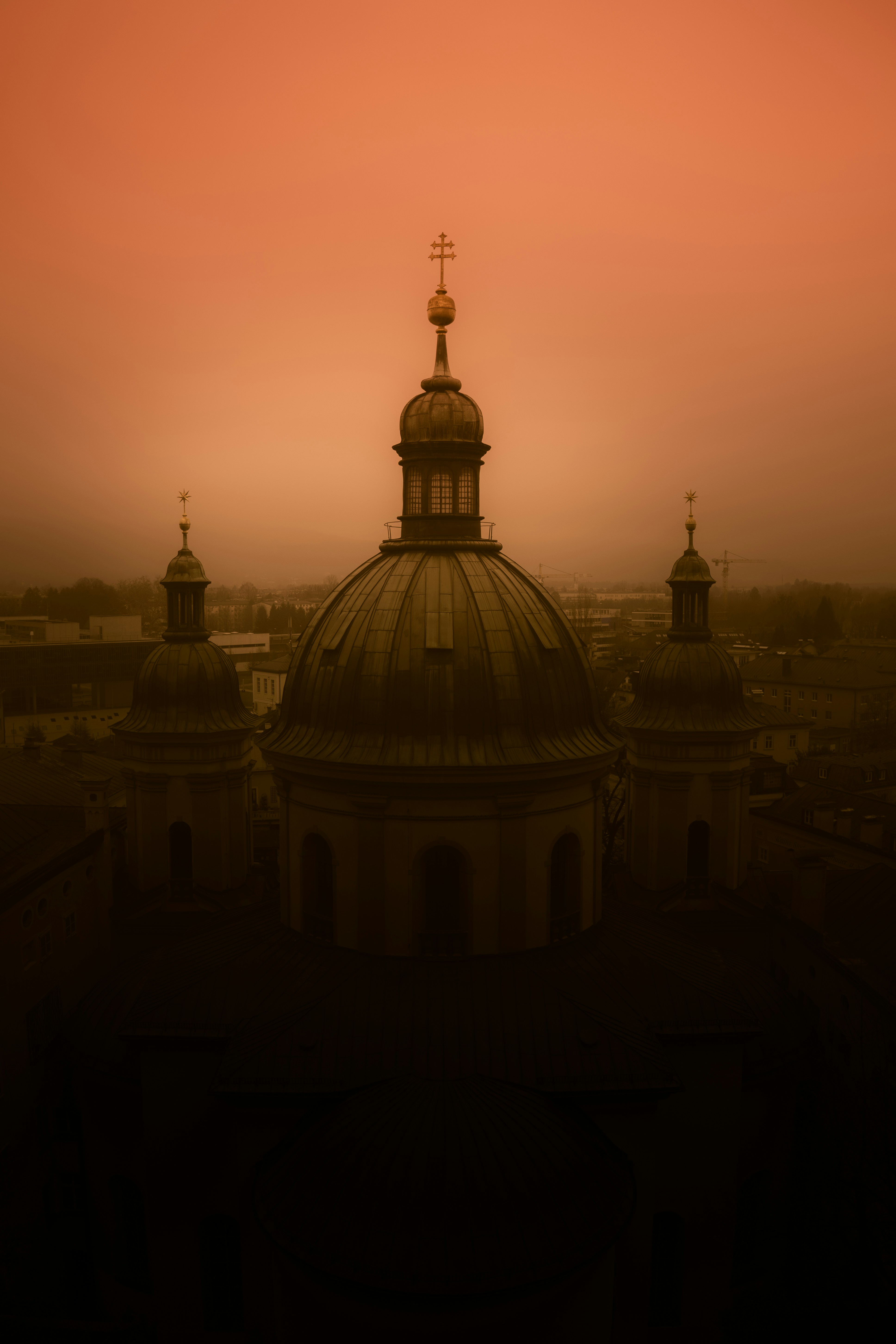 Dusk Over the Baroque Dome: A Quiet Orange Cityscape