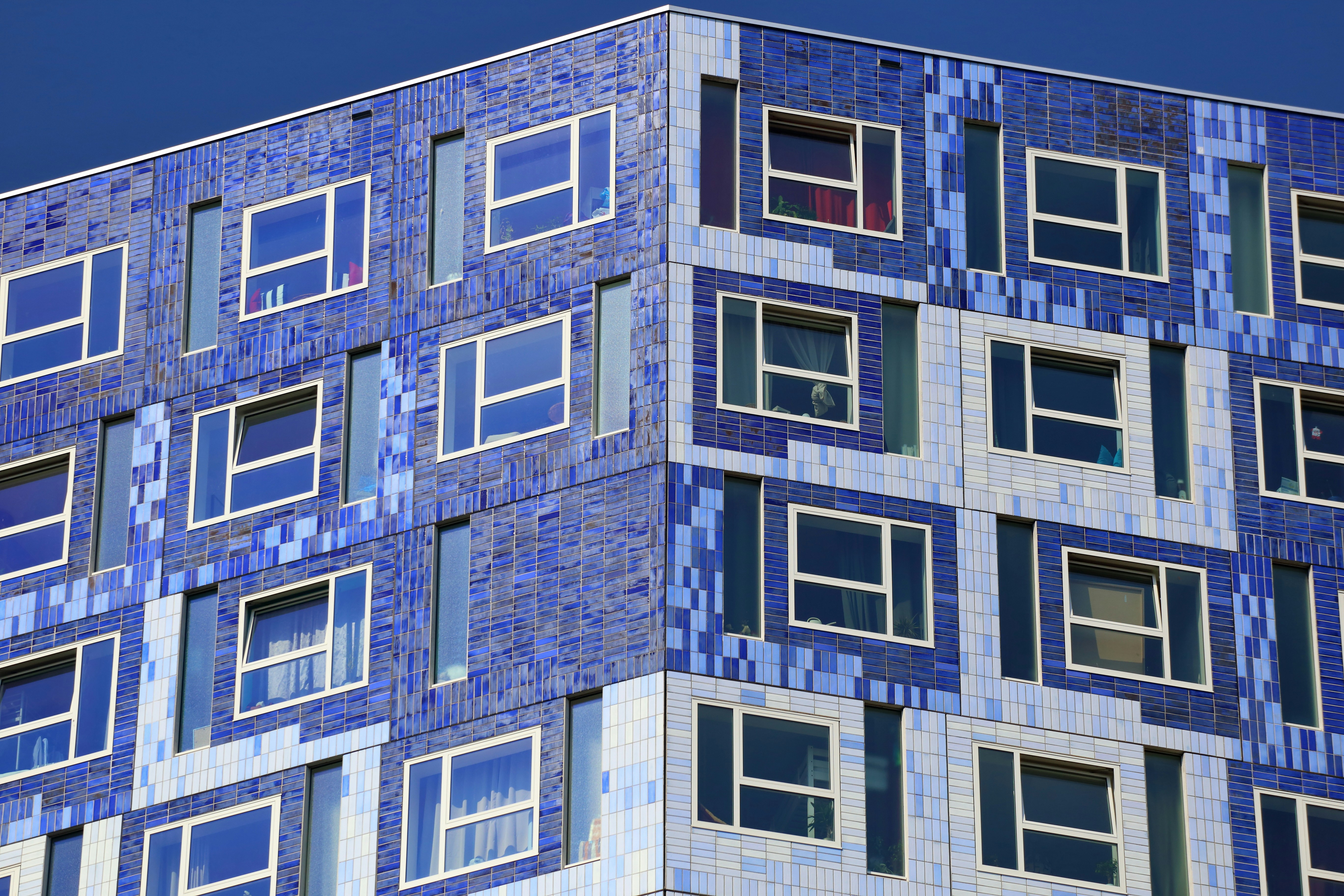 blue and gray concrete high-rise building during daytime