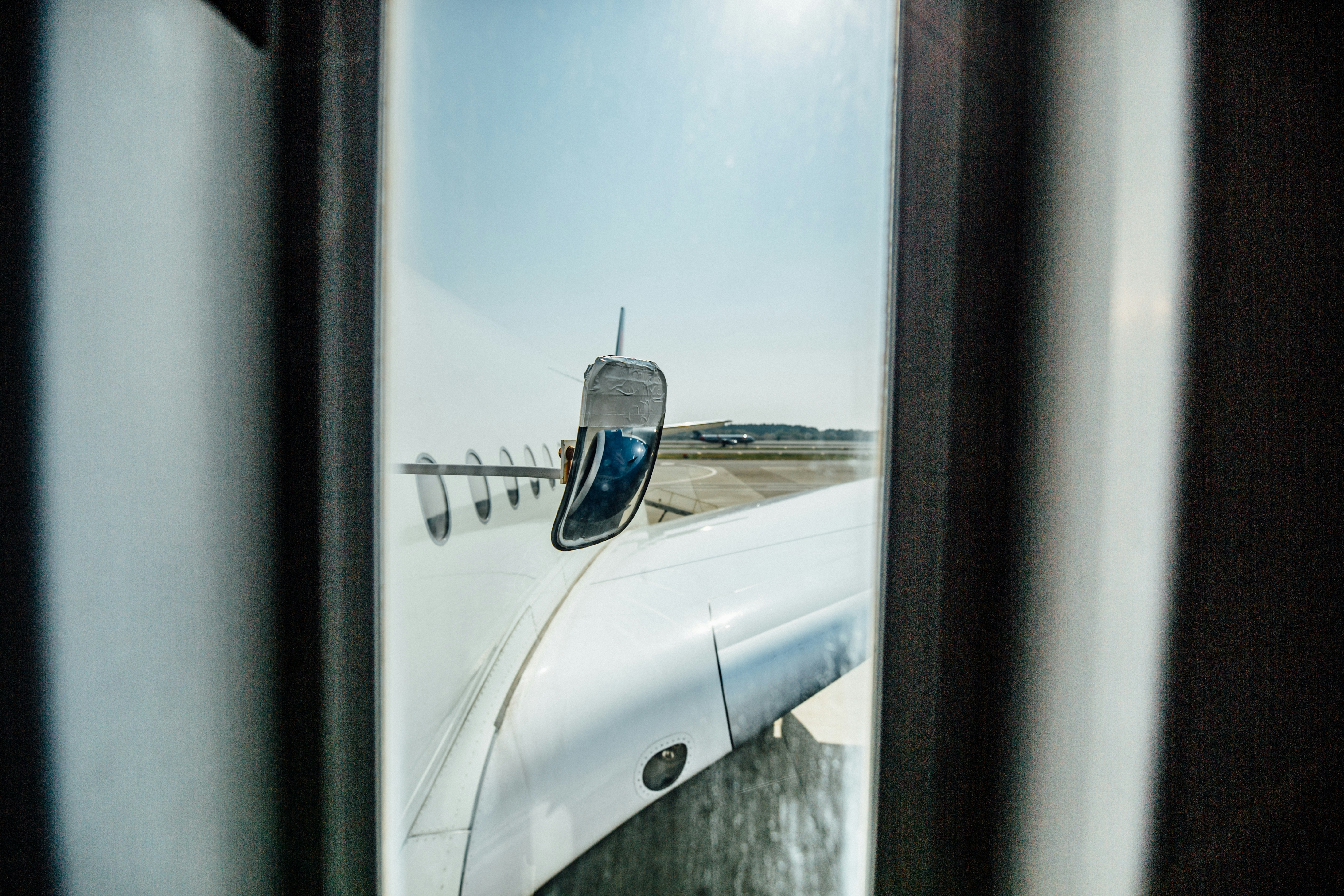 Winged Window: A Side Glance from the Jet Bridge