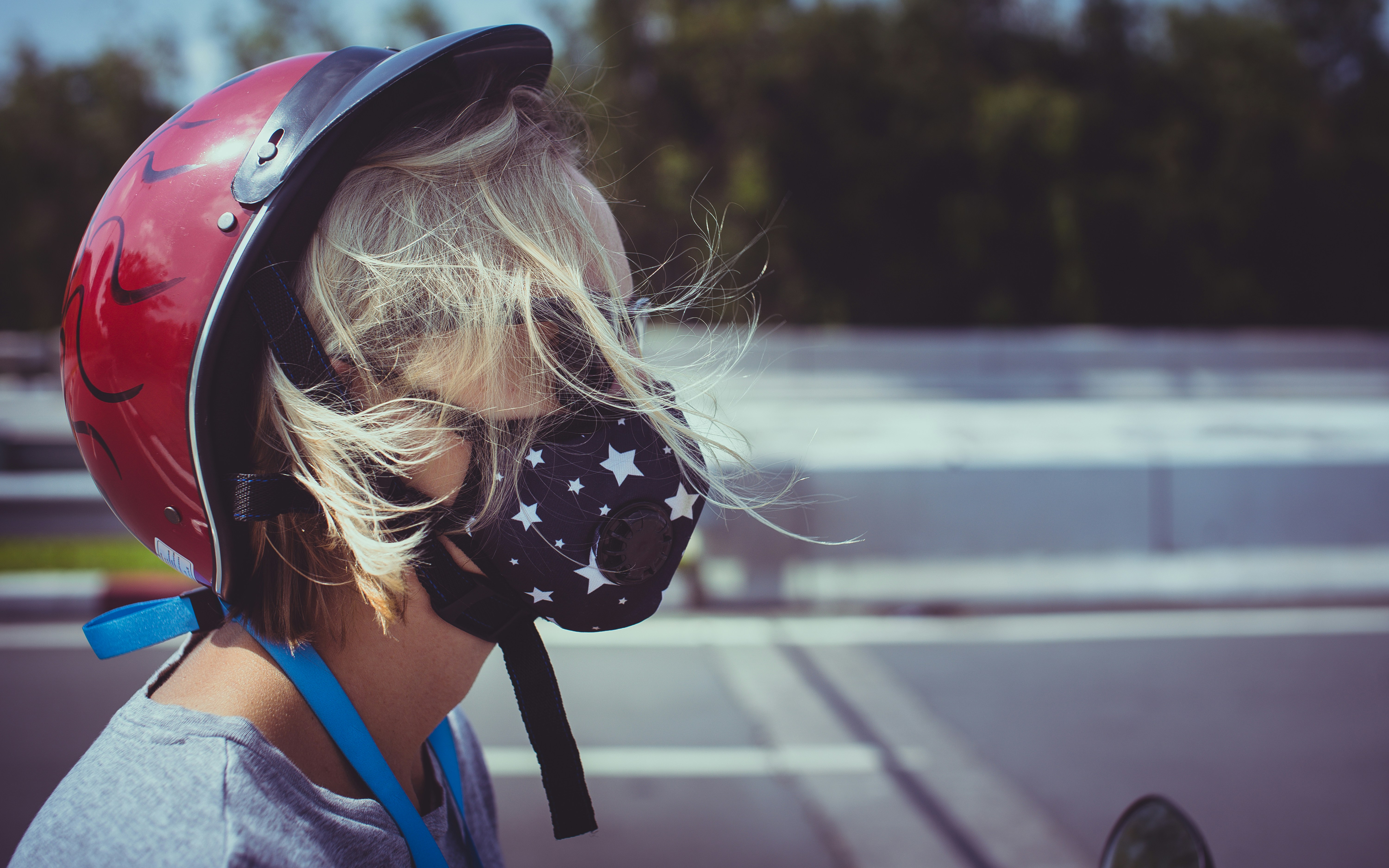 Helmeted rider in wind-swept profile
