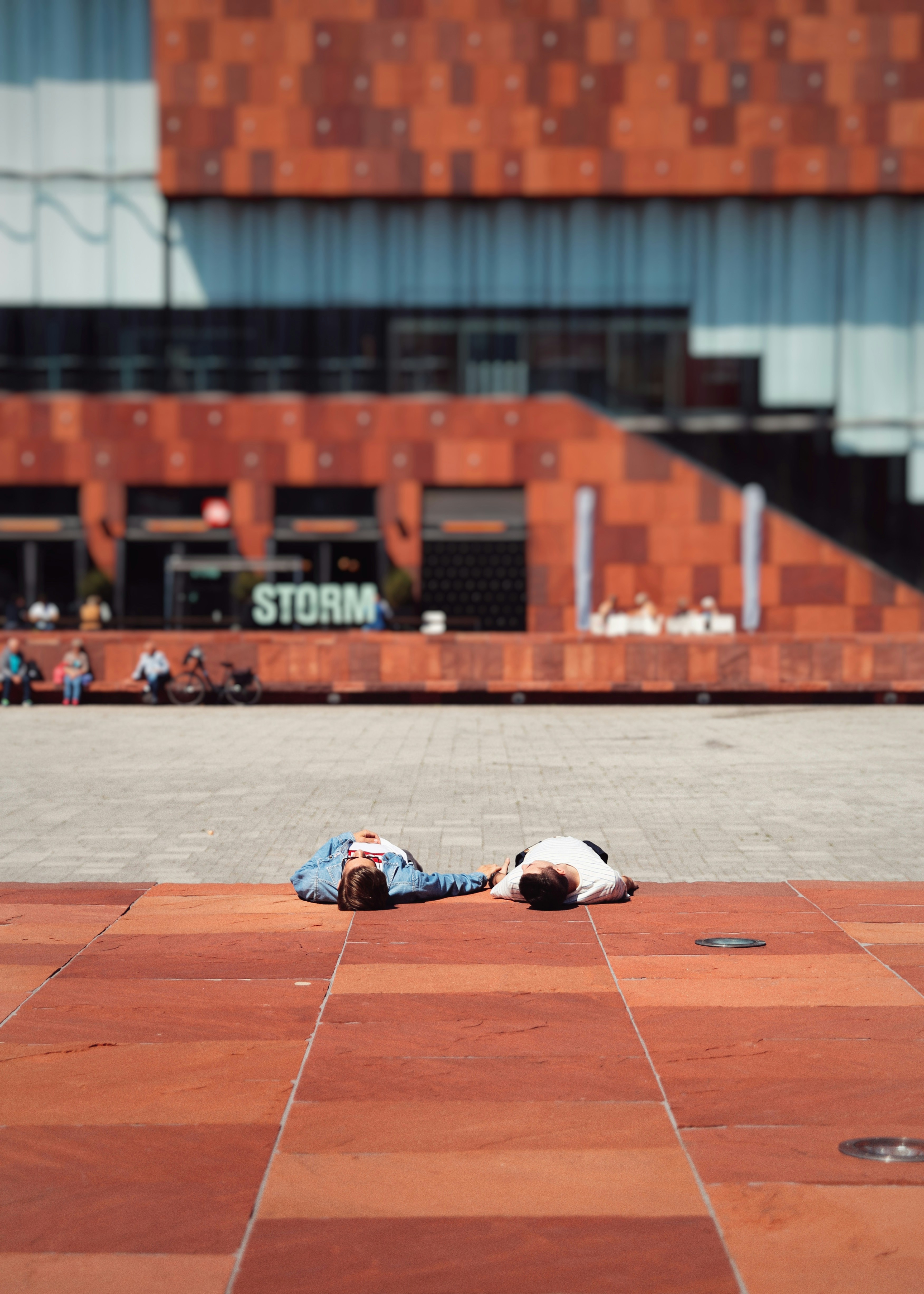 Two persons lying on ground photo – Free Antwerpen Image on Unsplash