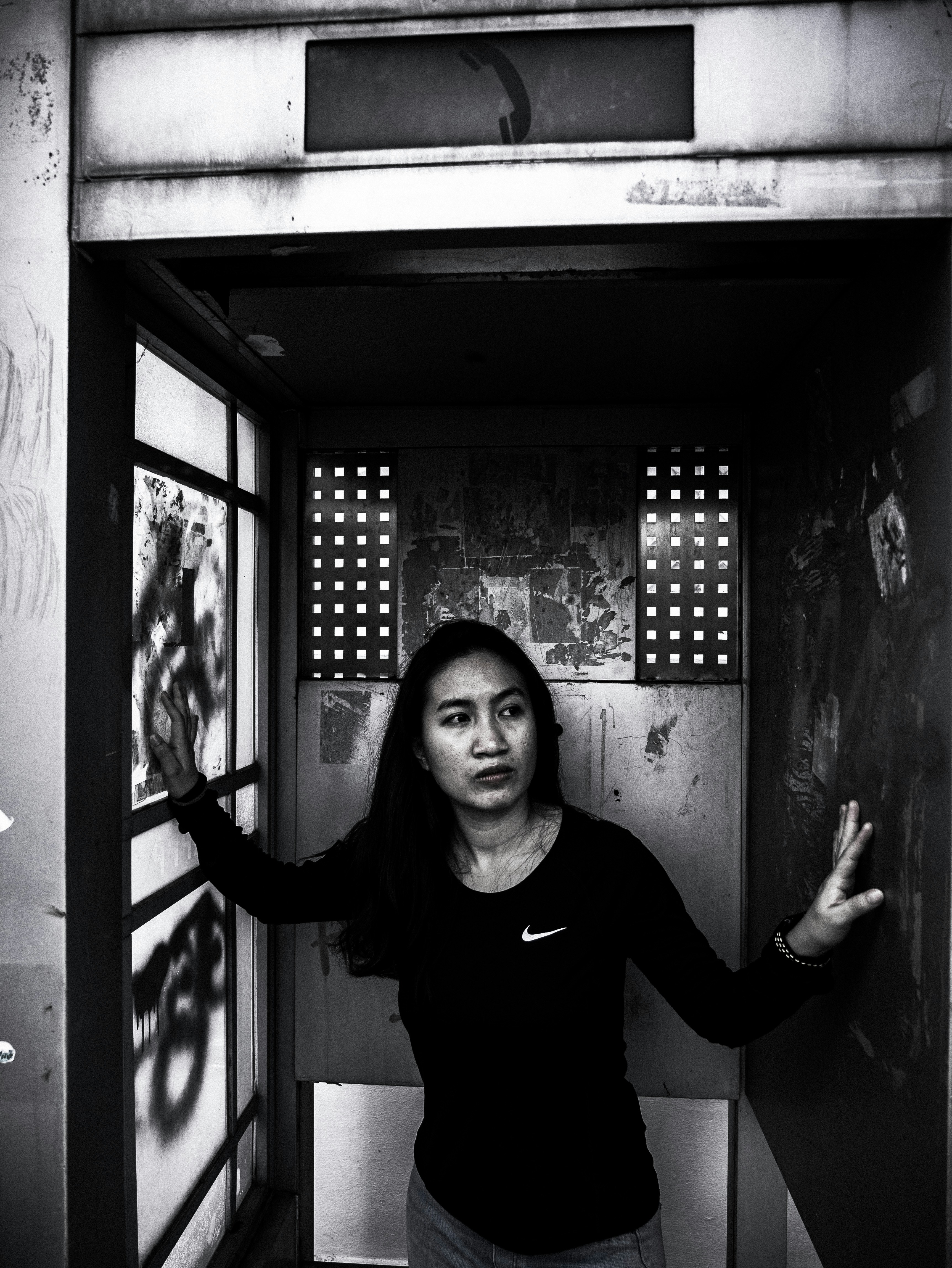Midnight in the Narrow Booth: A Woman Surveilling the Walls