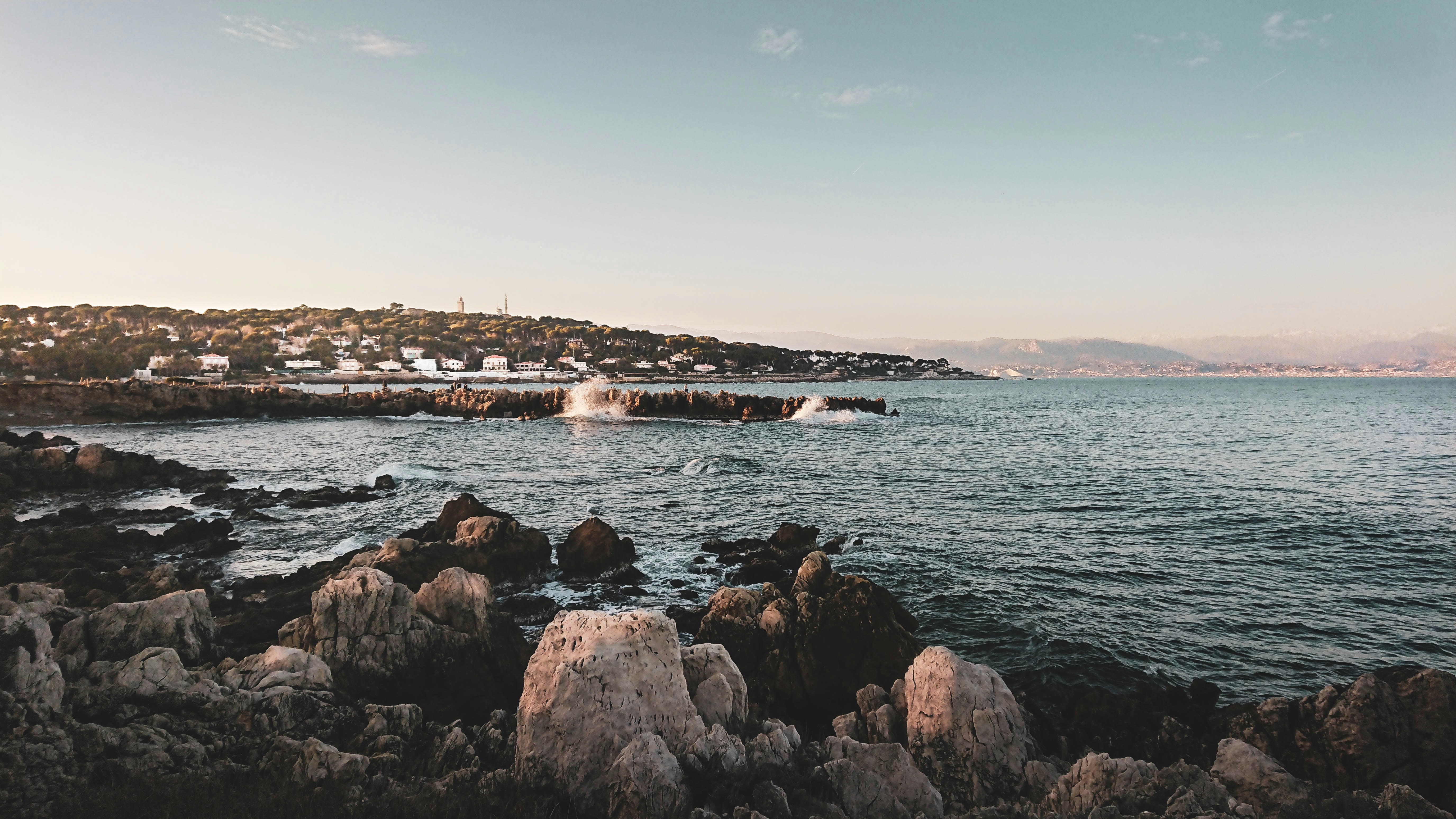 Rocks near sea at daytime photo – Free Grey Image on Unsplash