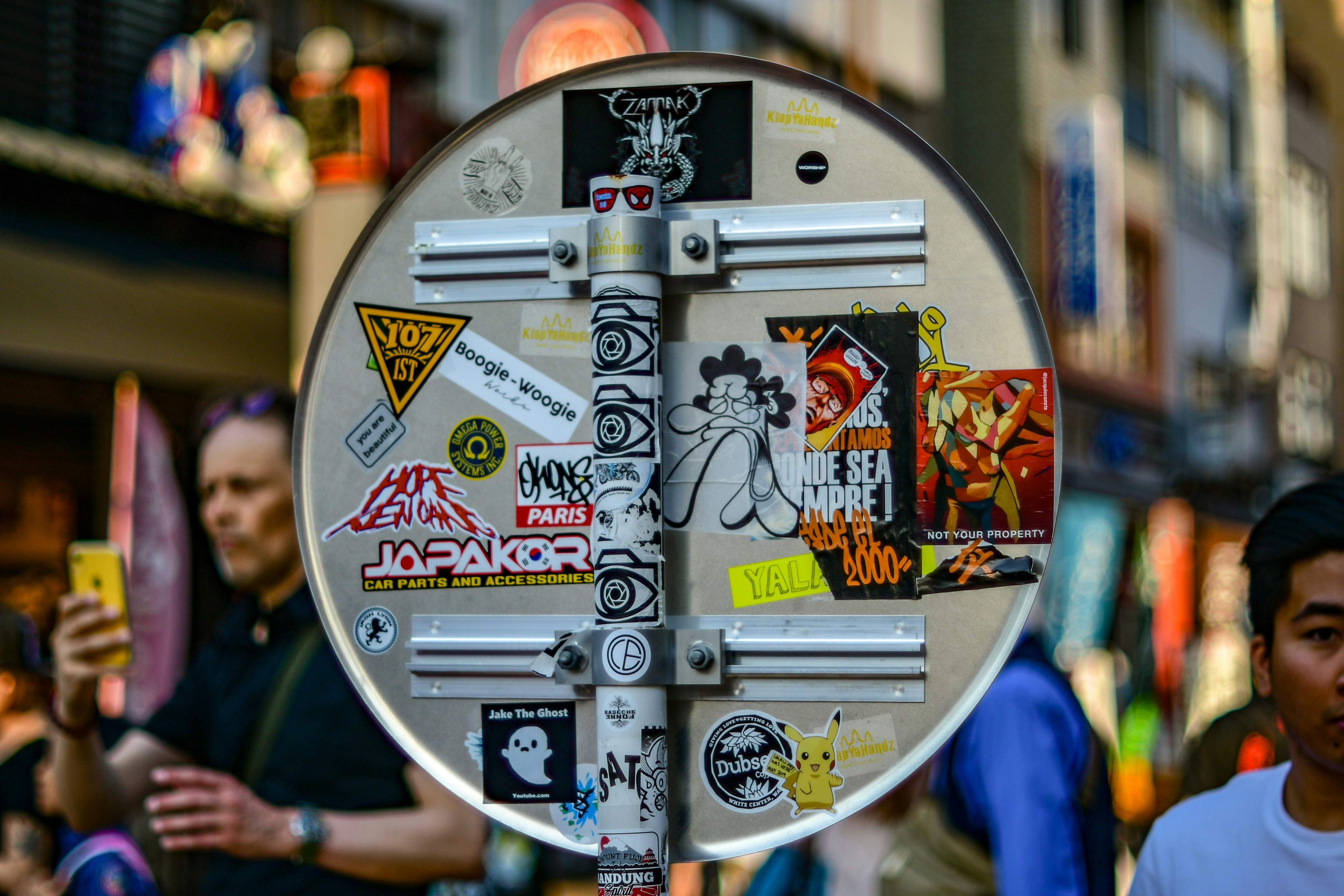 Road sign with stickers photo – Free Human Image on Unsplash