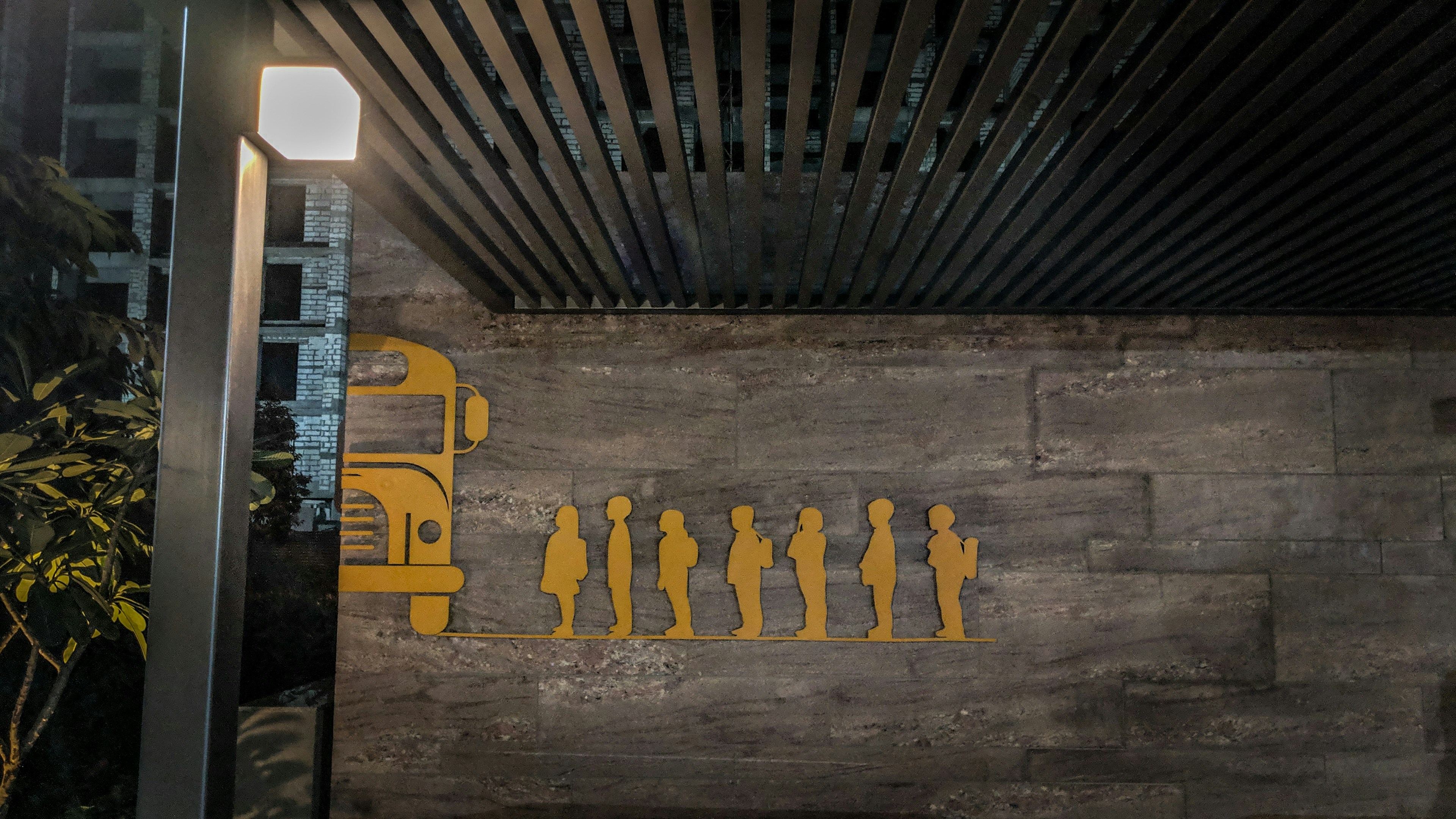 Children falling in line in front of bus painted wall photo – Free Art ...