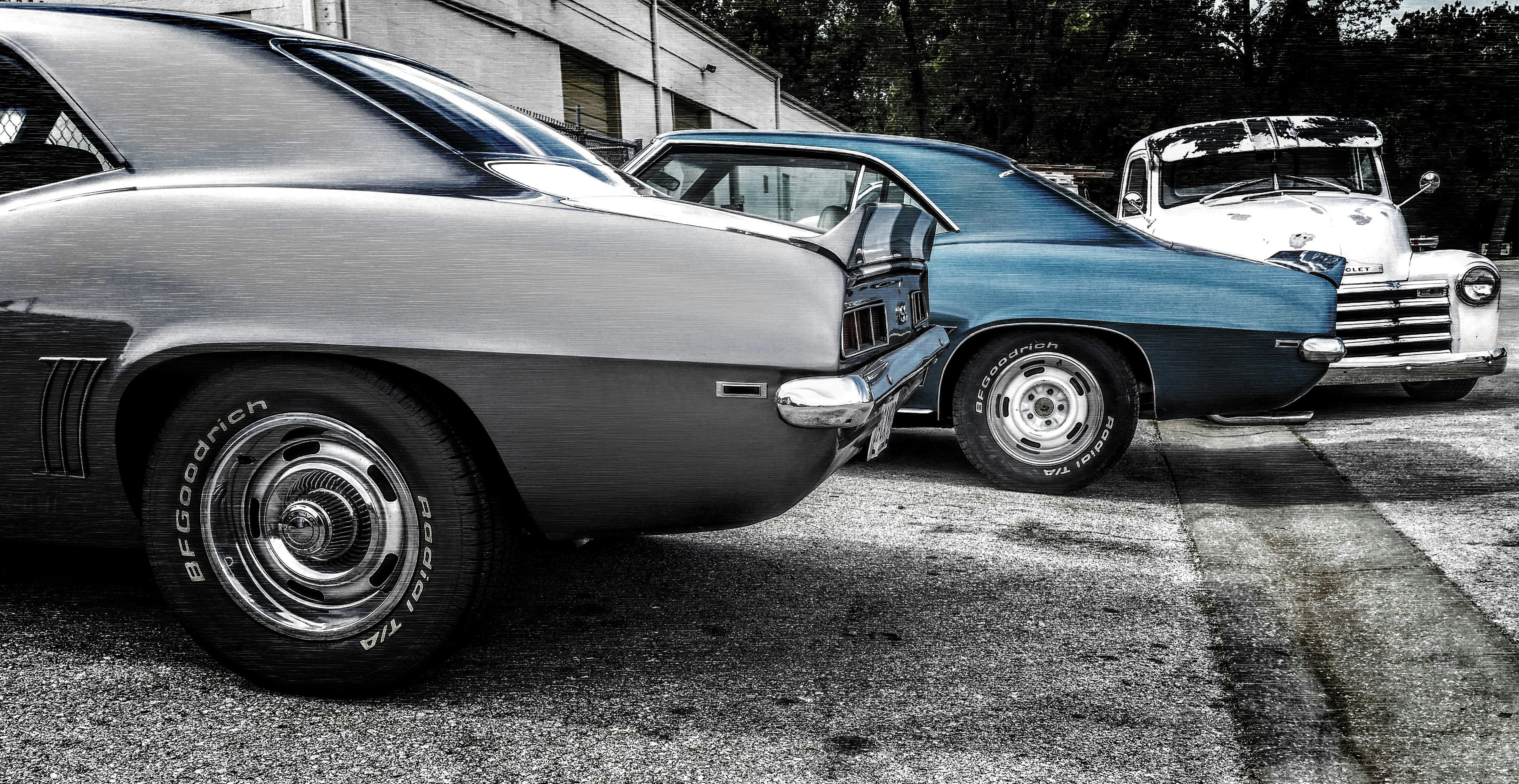 Grayscale photography of three vehicles photo – Free Grey Image on Unsplash