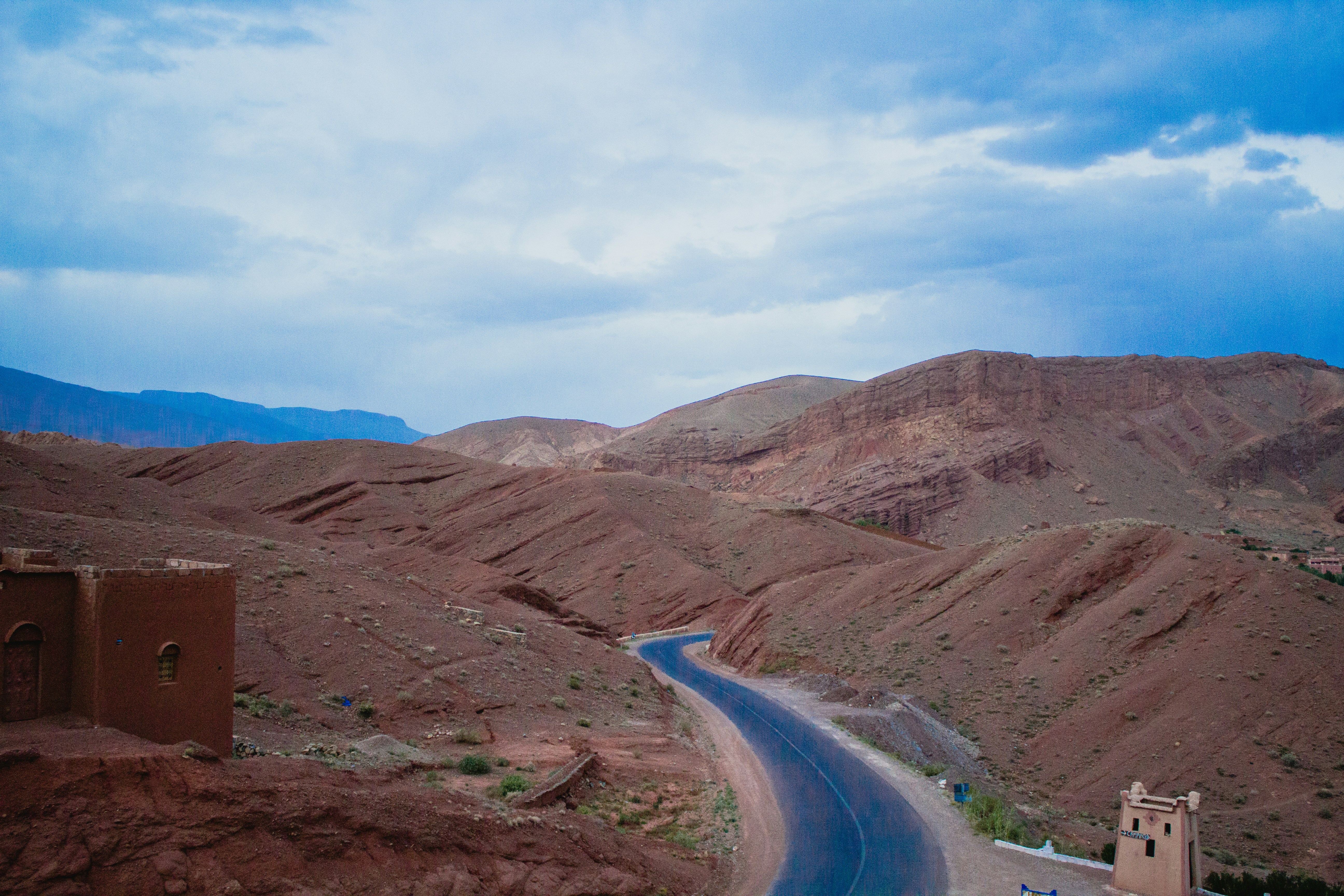 Serpentine Road Through Rust-Red Desert Valleys