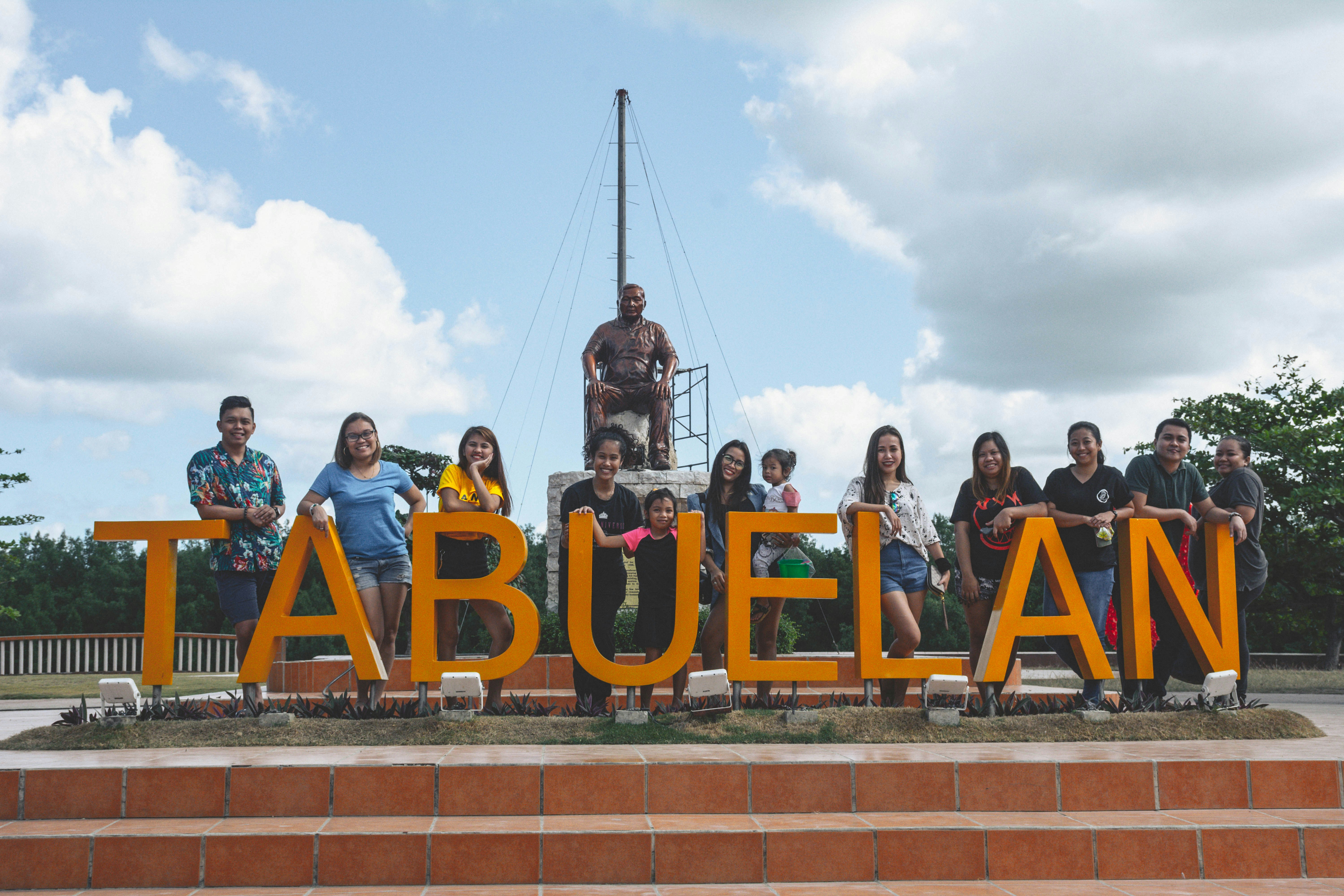 People standing in front of Tabuelan standee signage photo – Free Human ...