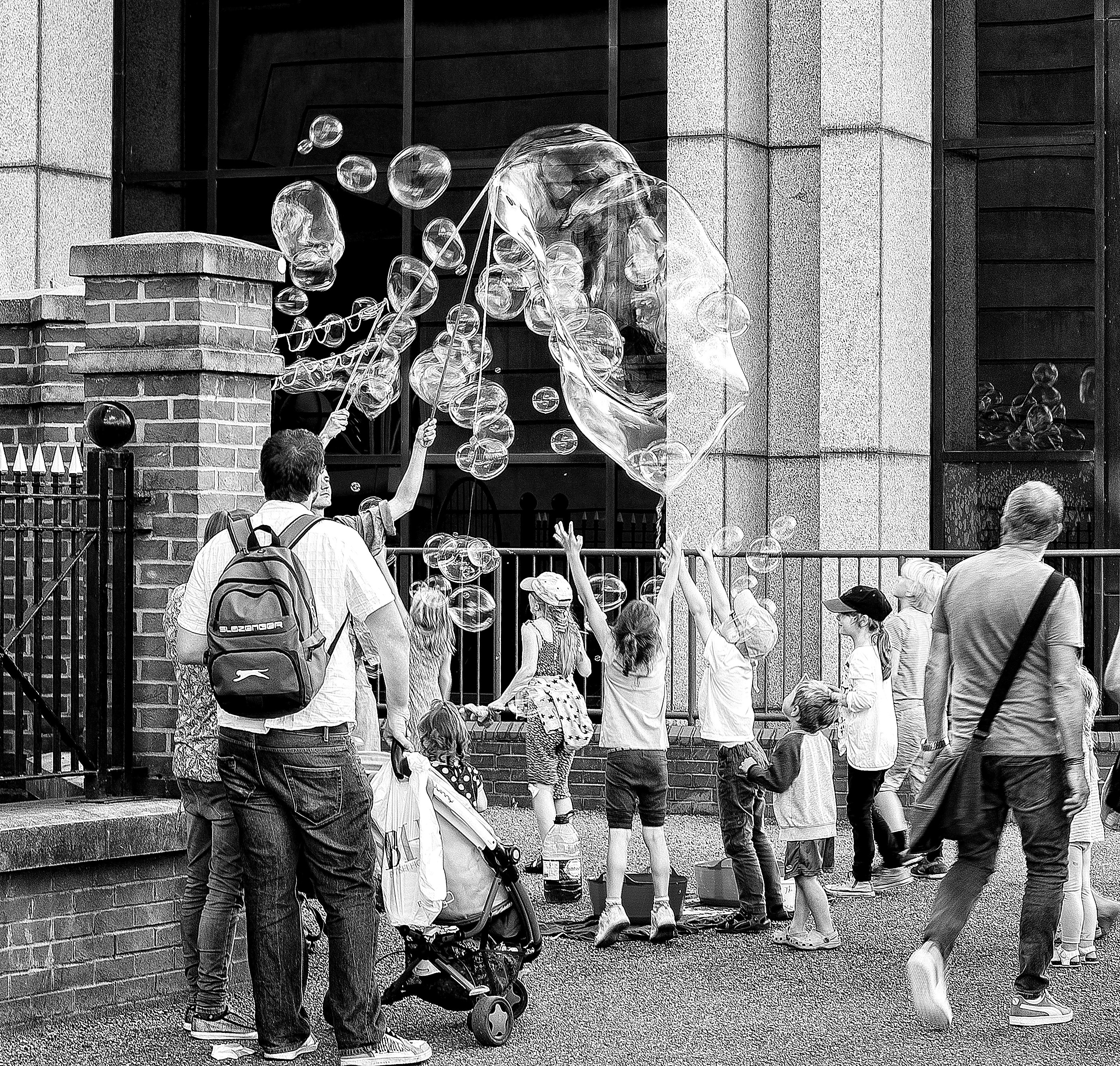Bubble Serenade in the Street Between Dancers and Onlookers