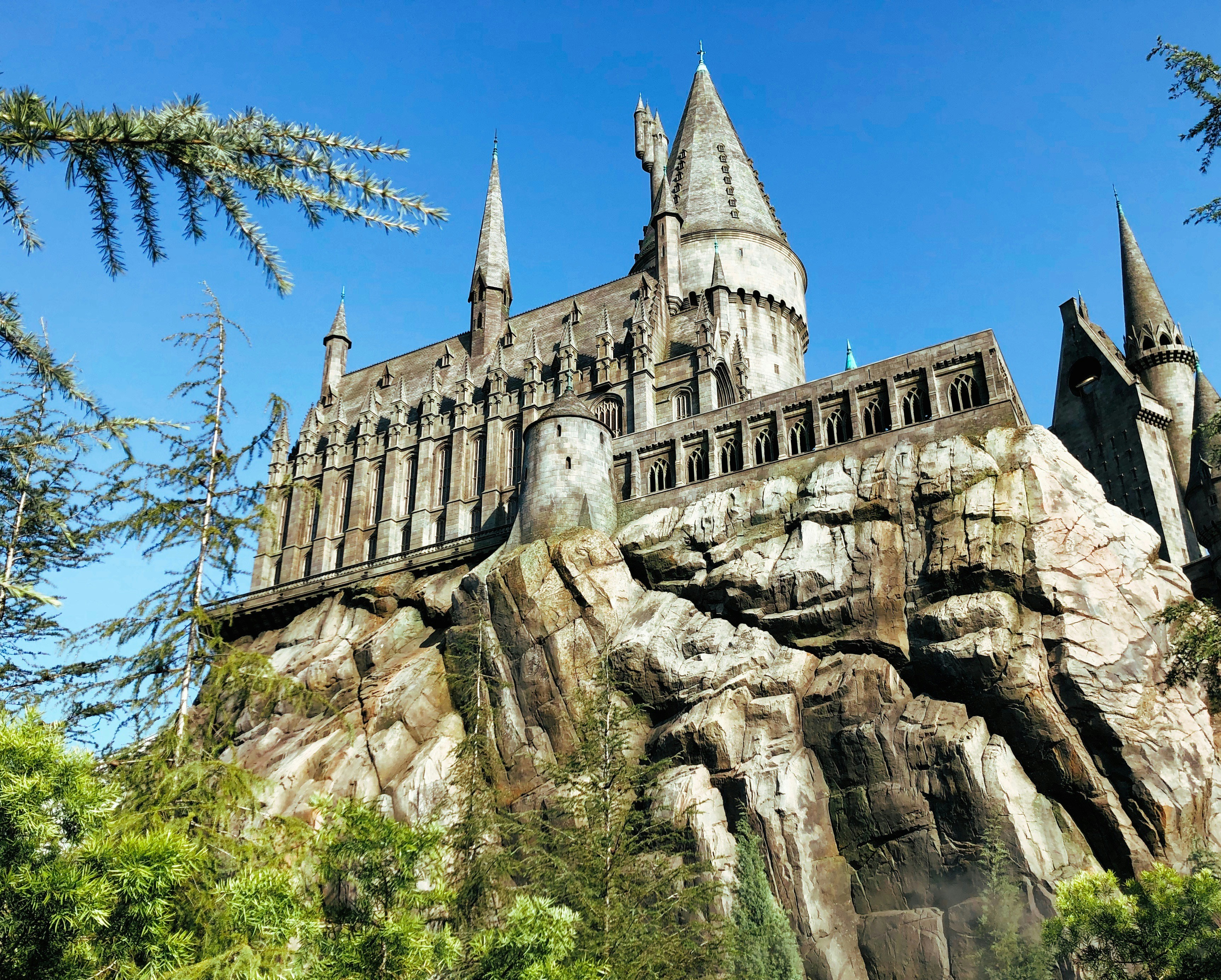 Stone Citadel Crowned by Granite Cliffs Under a Cerulean Sky
