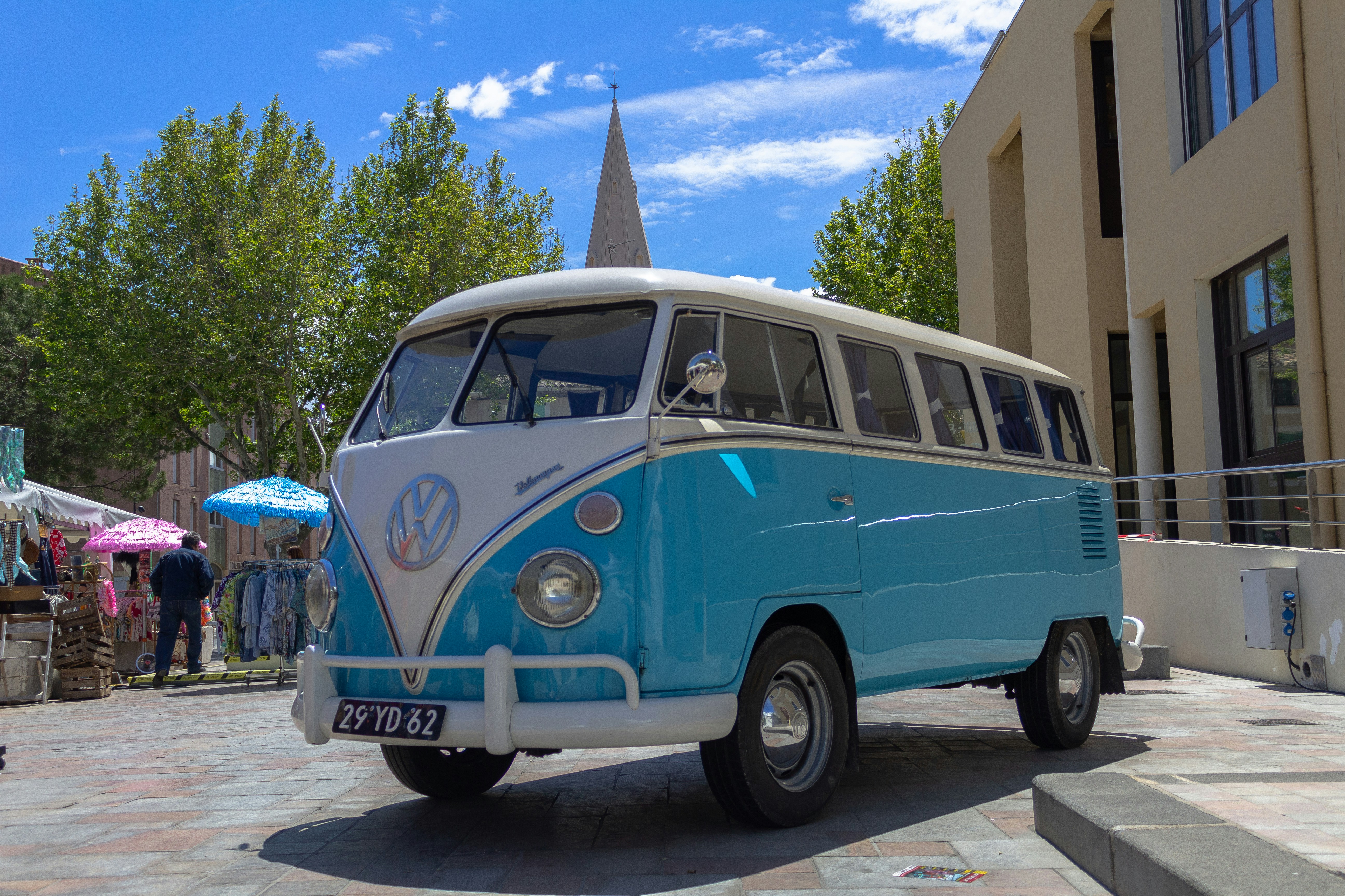 White and blue Volkswagen van parked near building photo – Free Blue ...