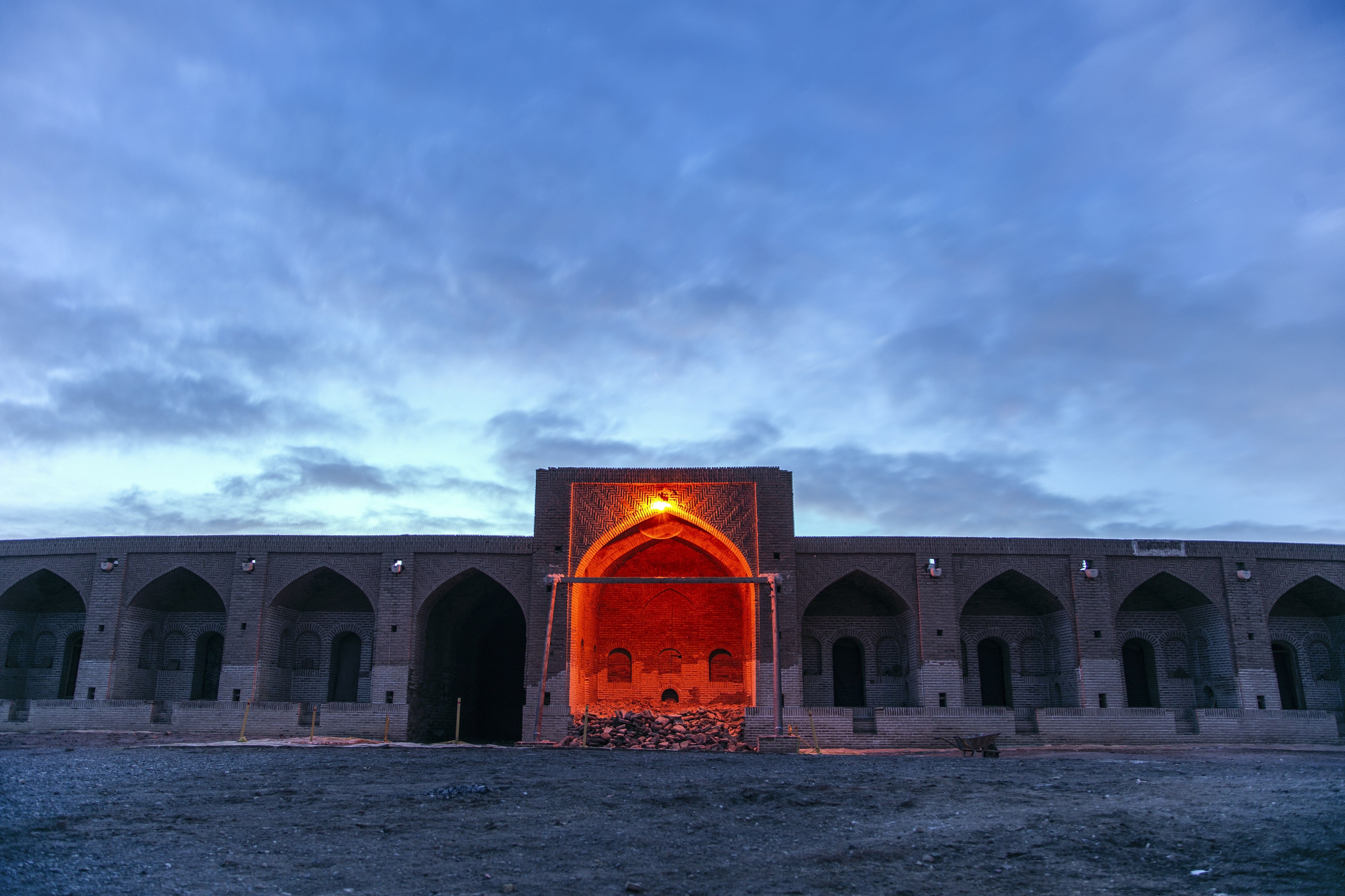 Embered Archway at Twilight: A Quiet Corridor of Arches