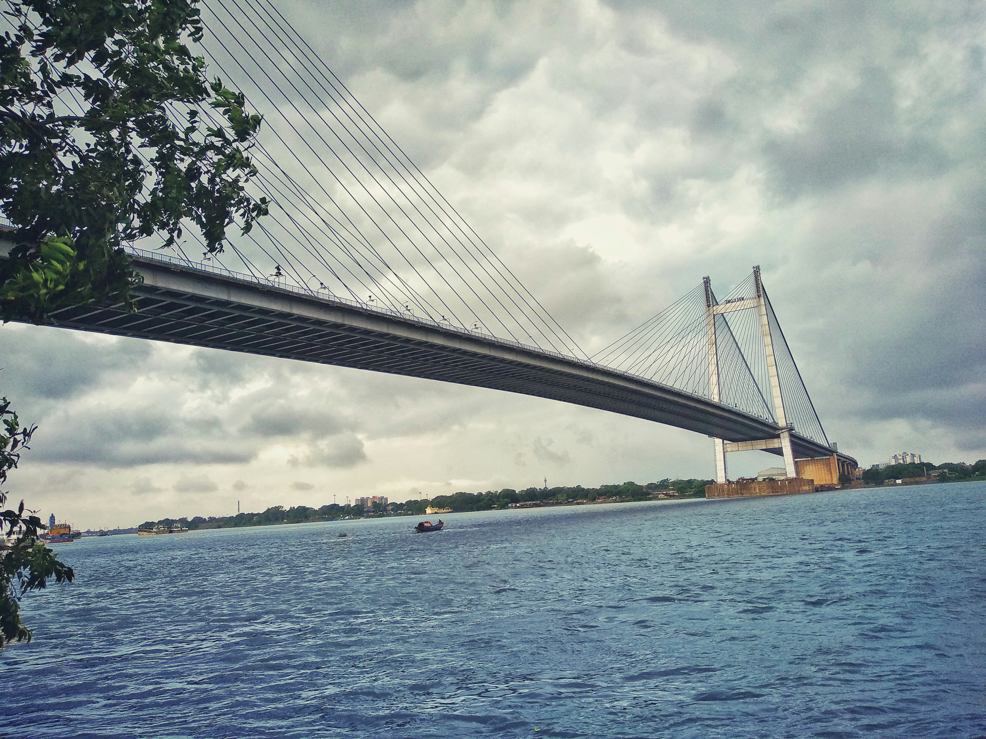 Gray concrete bridge under nimbus clouds photo – Free Grey Image on ...