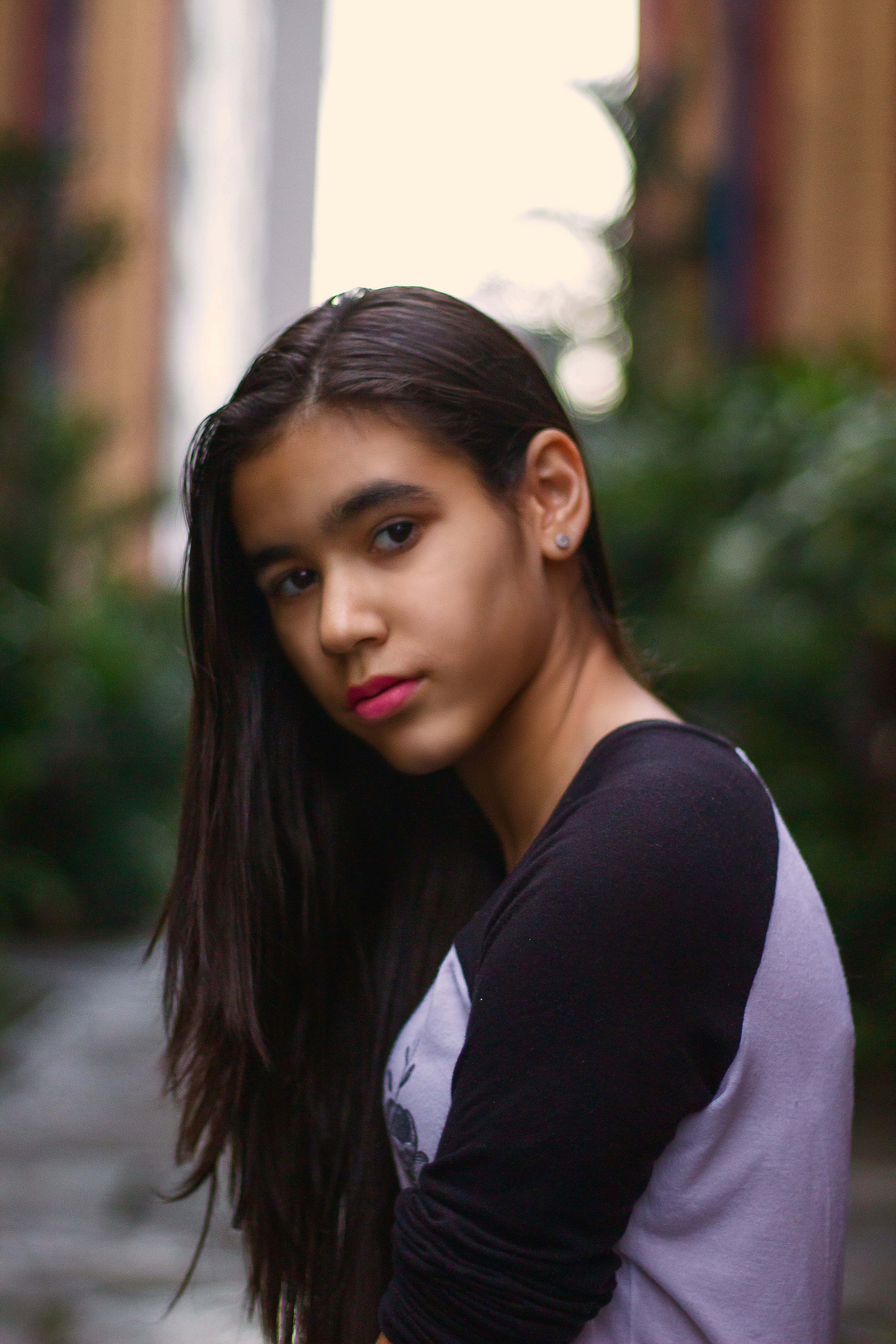 Woman in black and white sweat shirt looking over left shoulder photo ...