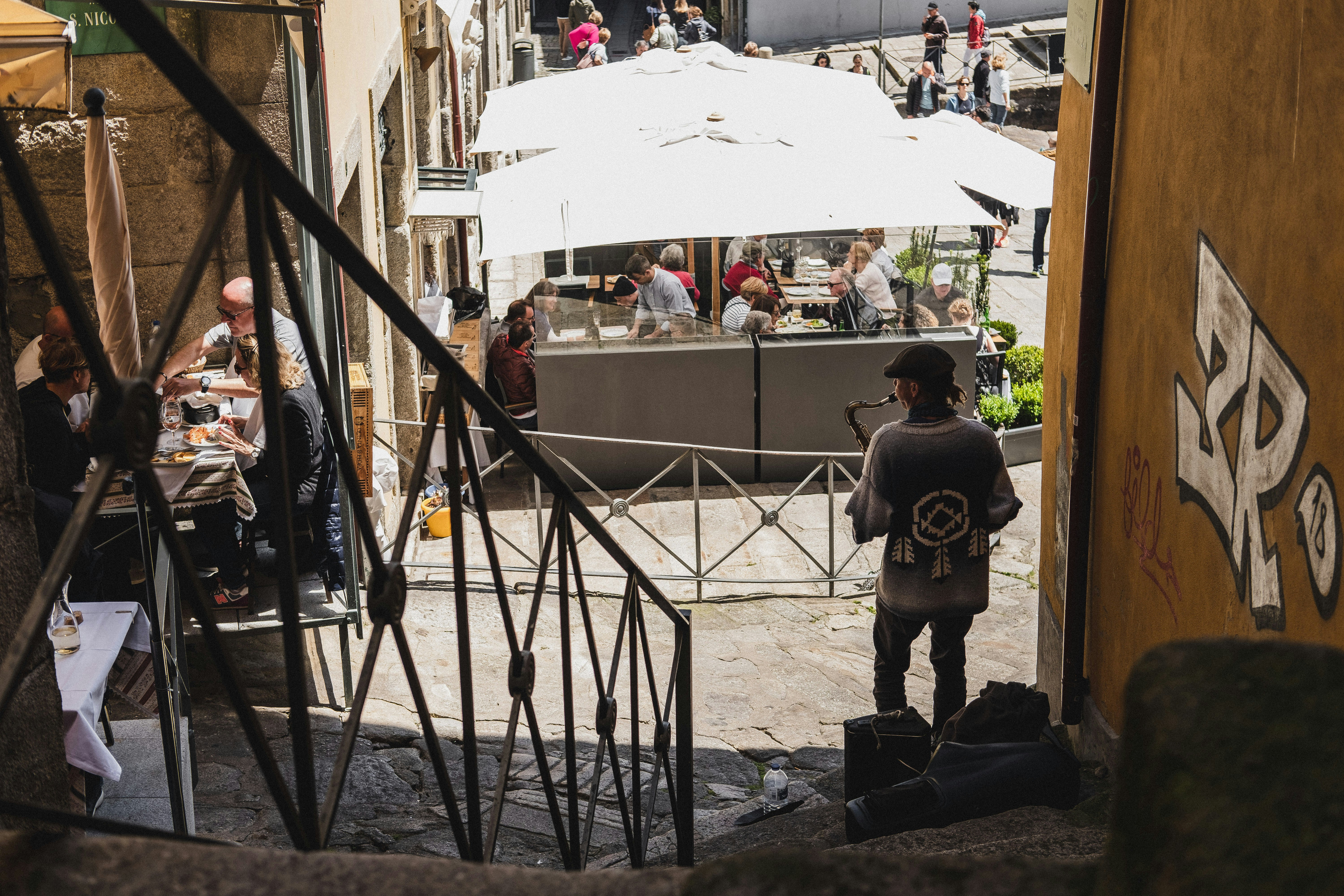 The Street Serenade: A Guitarist at the Back Courtyard