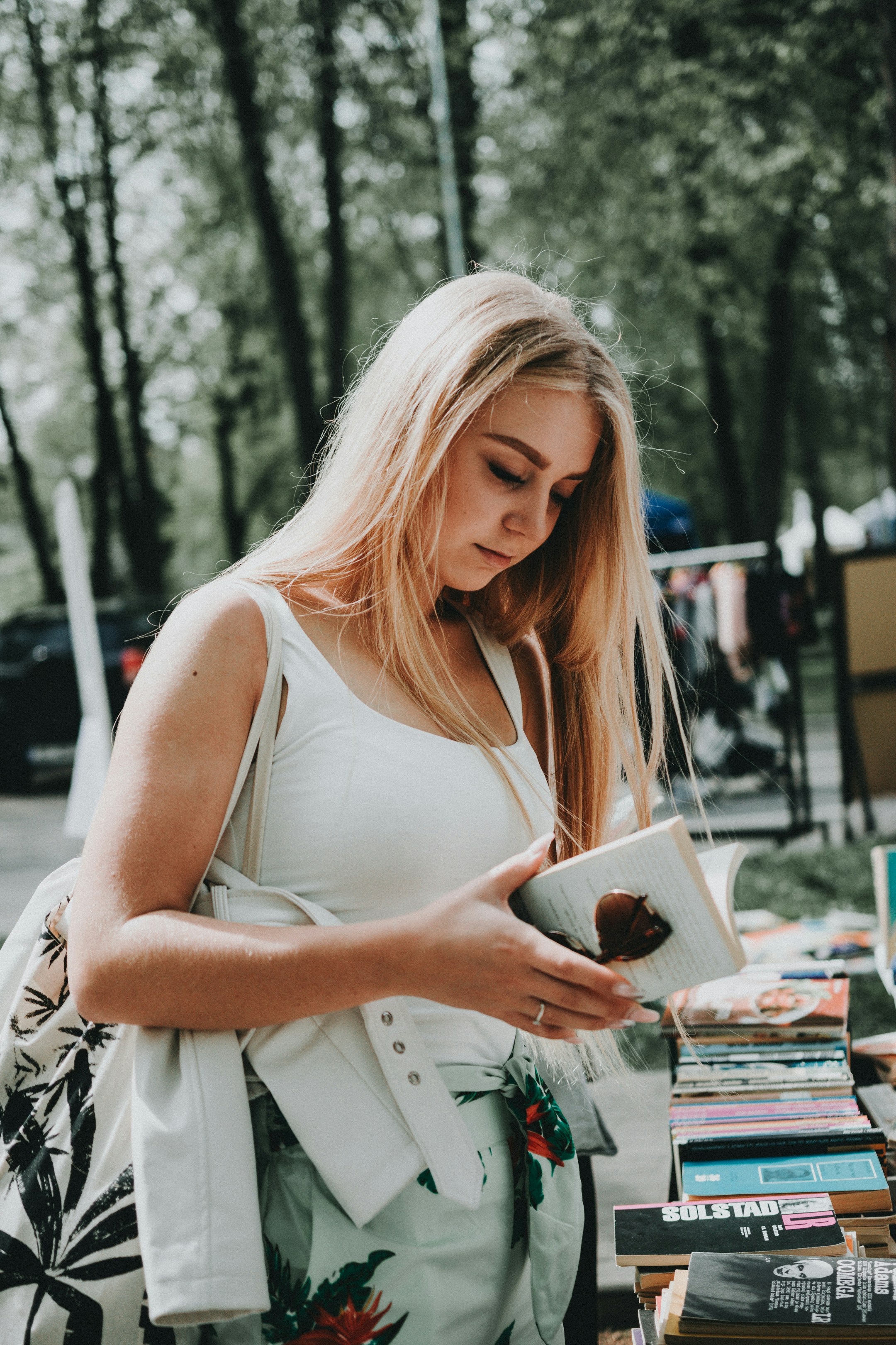Reading in the Park: A Quiet Moment Among Stacks