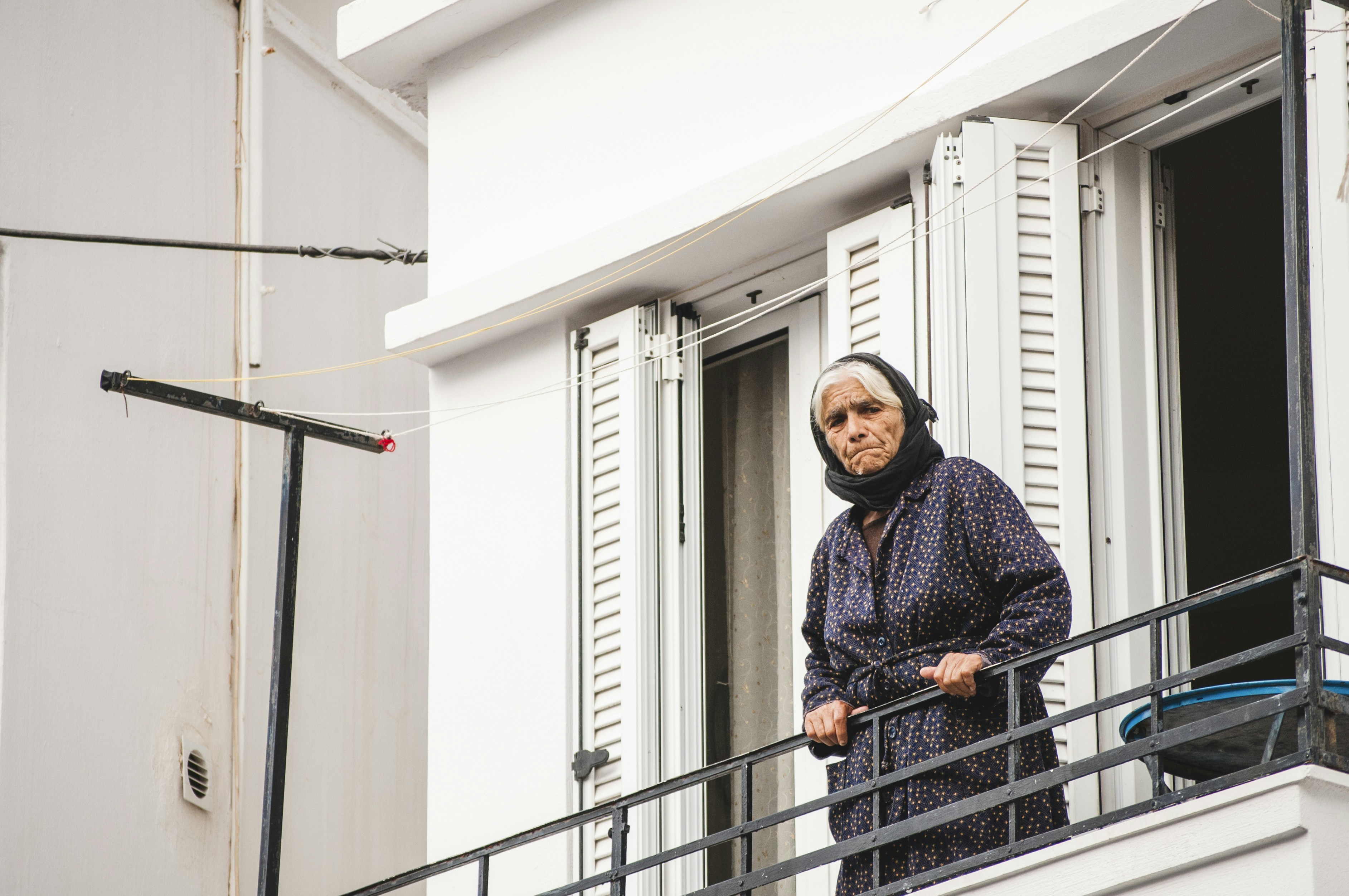 Woman standing near open window photo – Free Banister Image on Unsplash