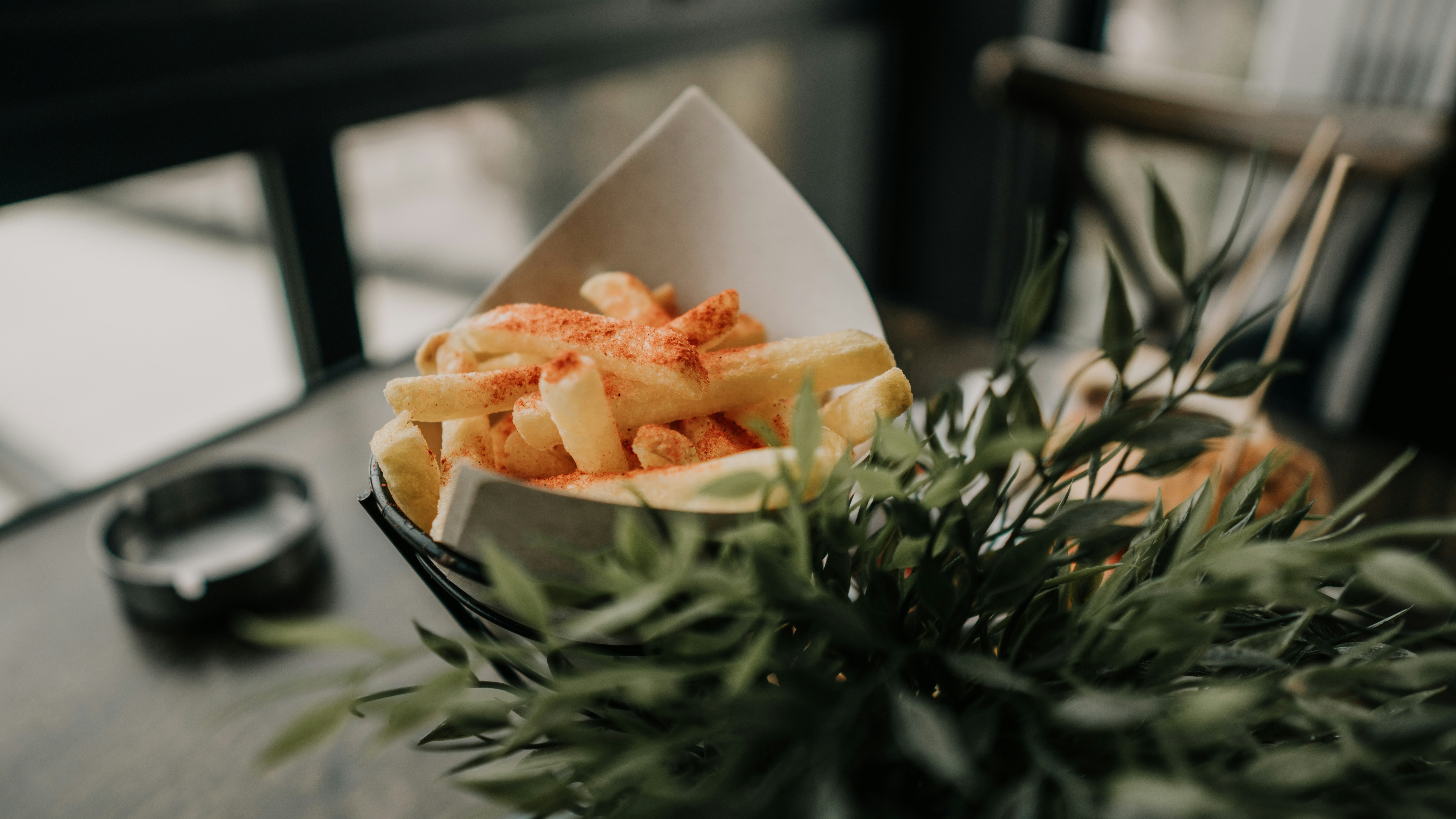 Conical Crisp: Golden Fries in a Quiet Cafe Glow