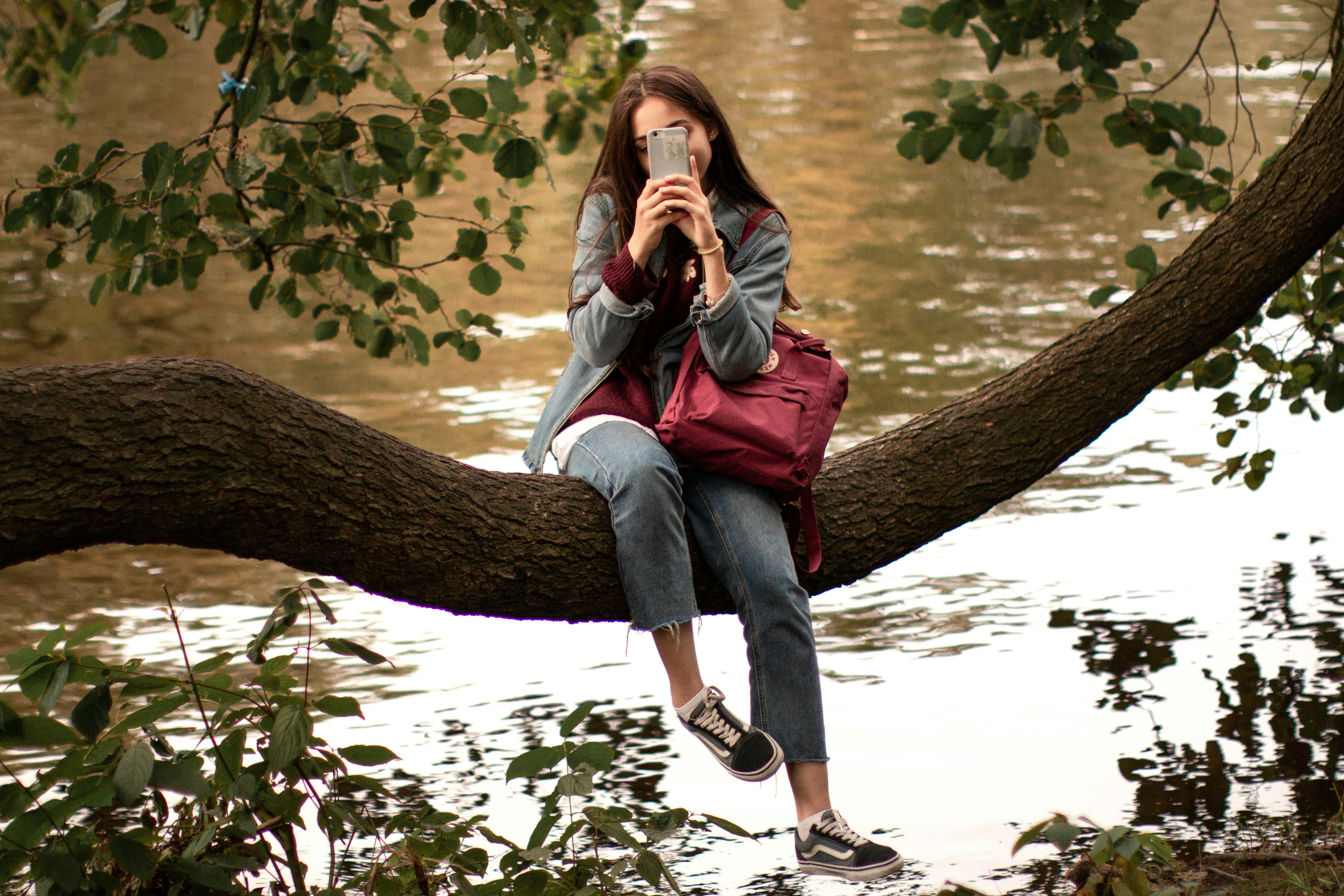 Branch-Side Riverside Selfie: A Quiet Portrait Above the Water