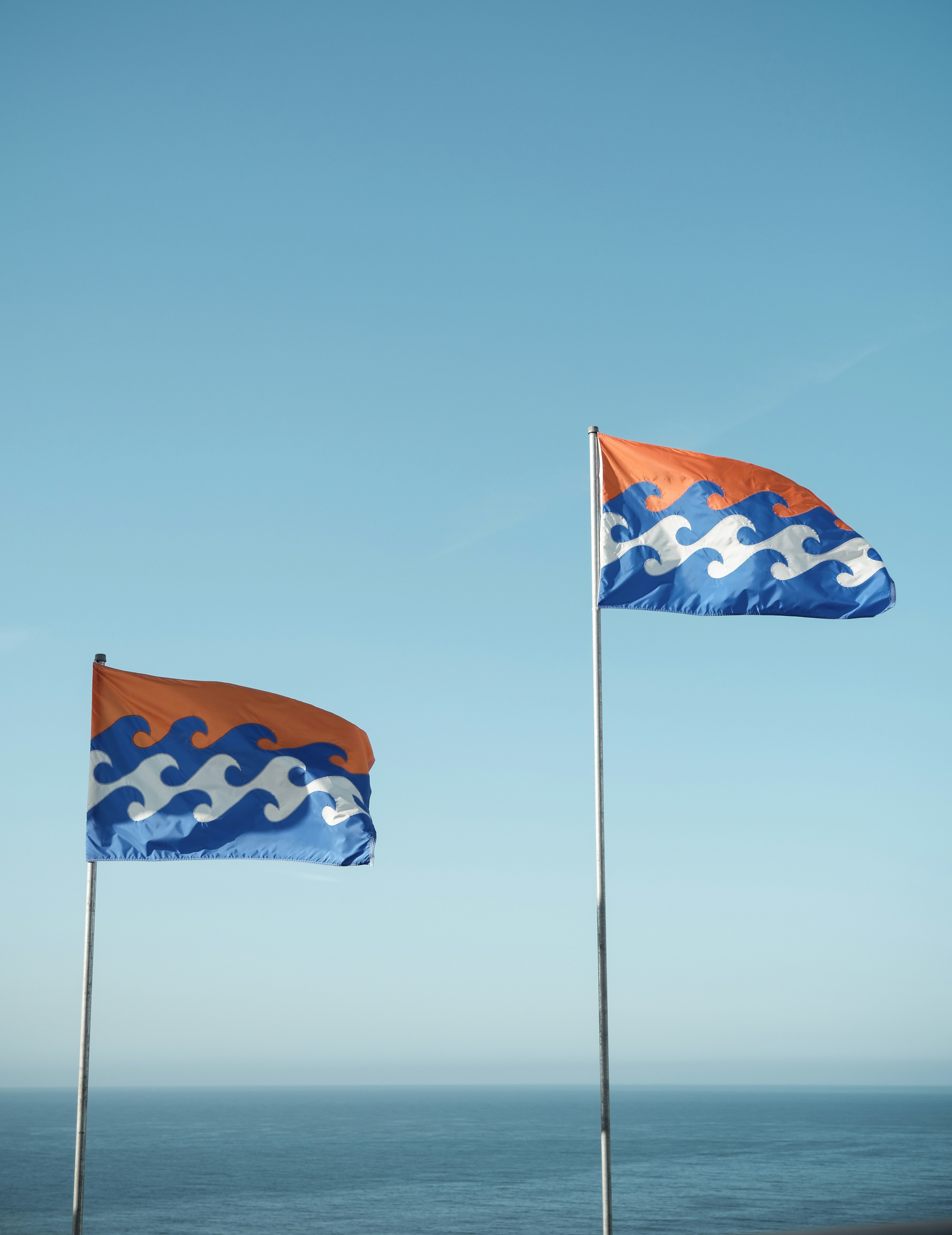 Orange-white-and-blue waving flags photo – Free Malibu Image on Unsplash