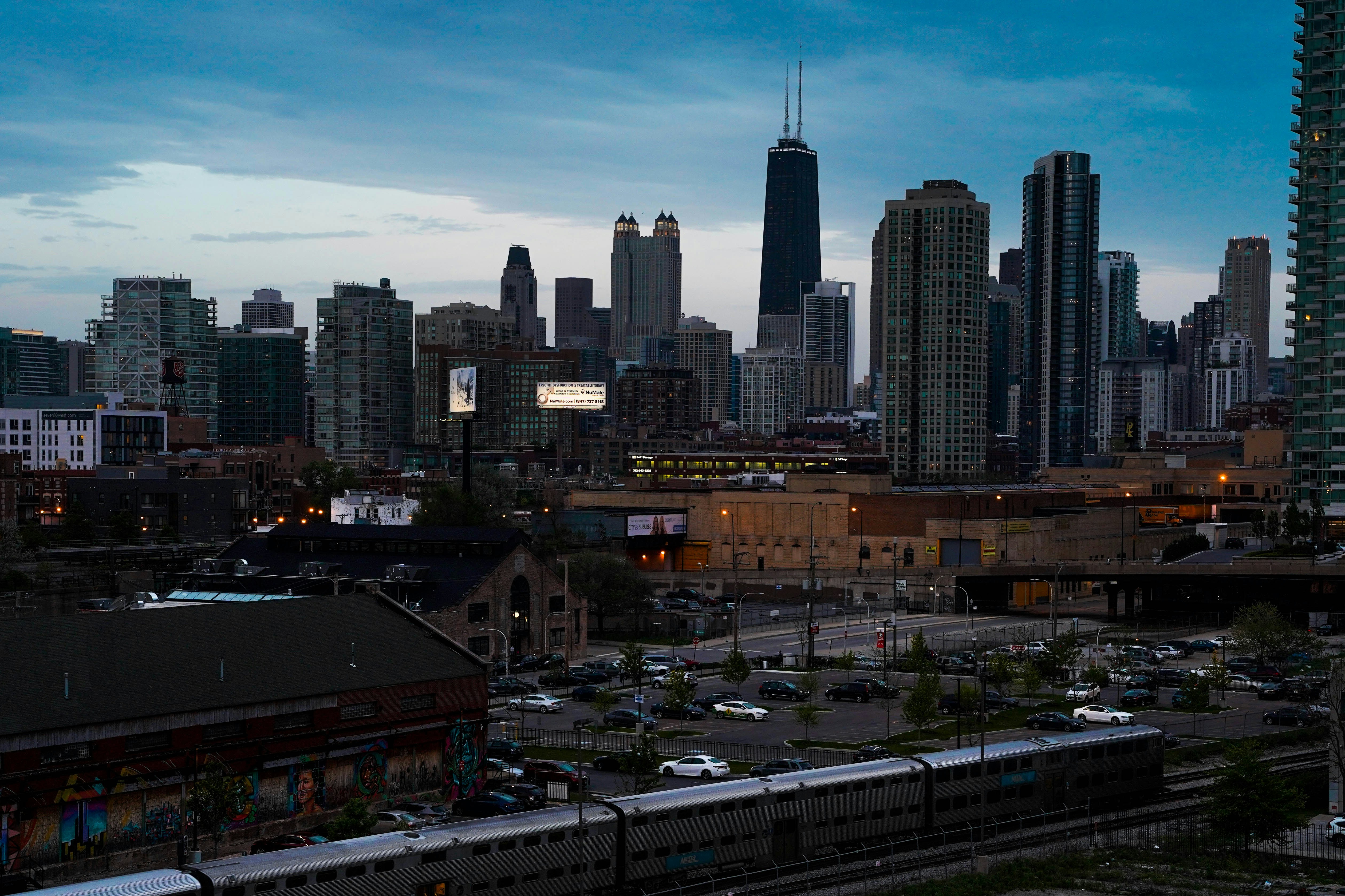 Blue Hour Between Rails and Glass: A City Skyline at Dusk