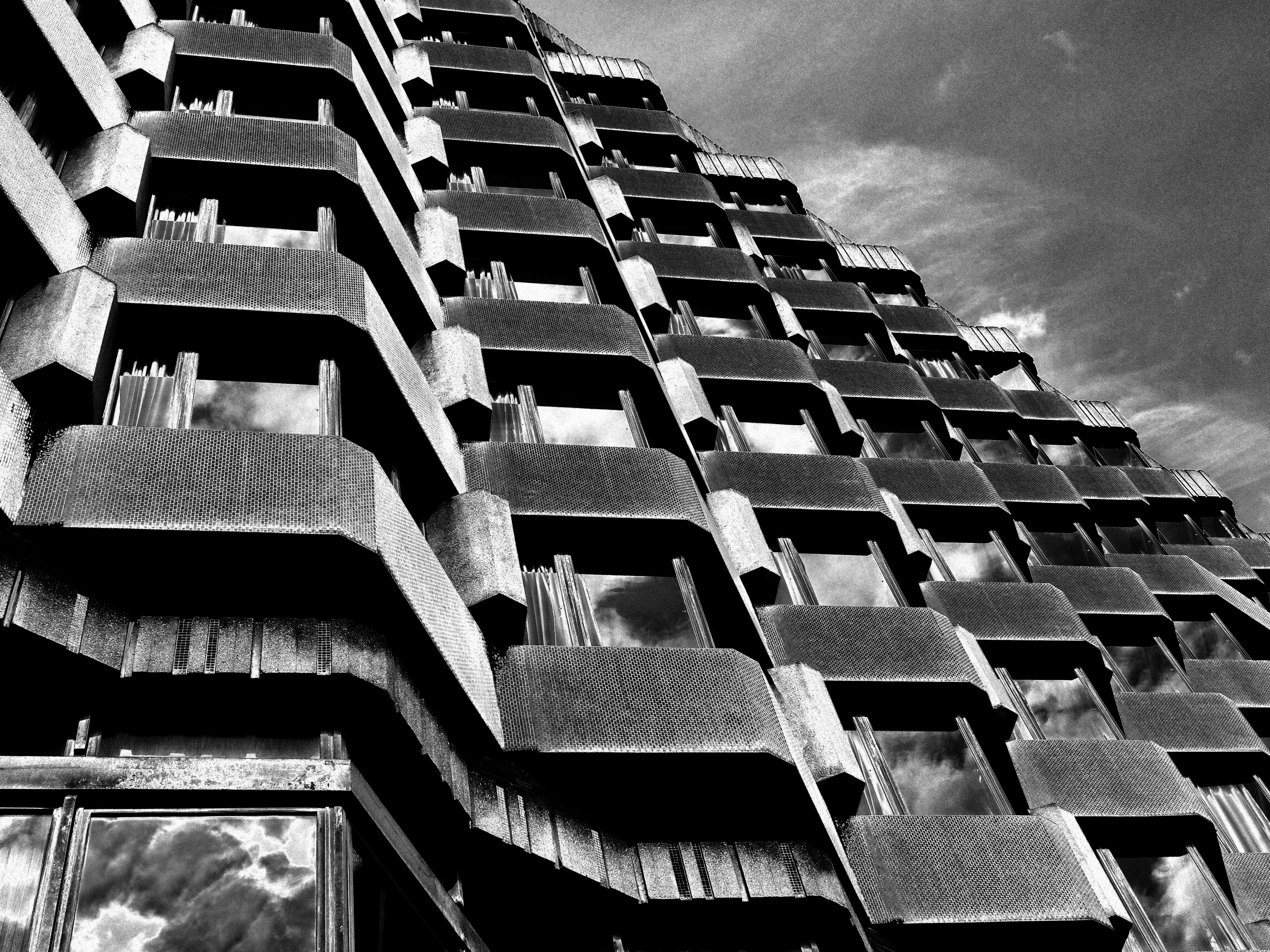 Concrete Crescents: A Distant Look Up at Repeating Balcony Geometry