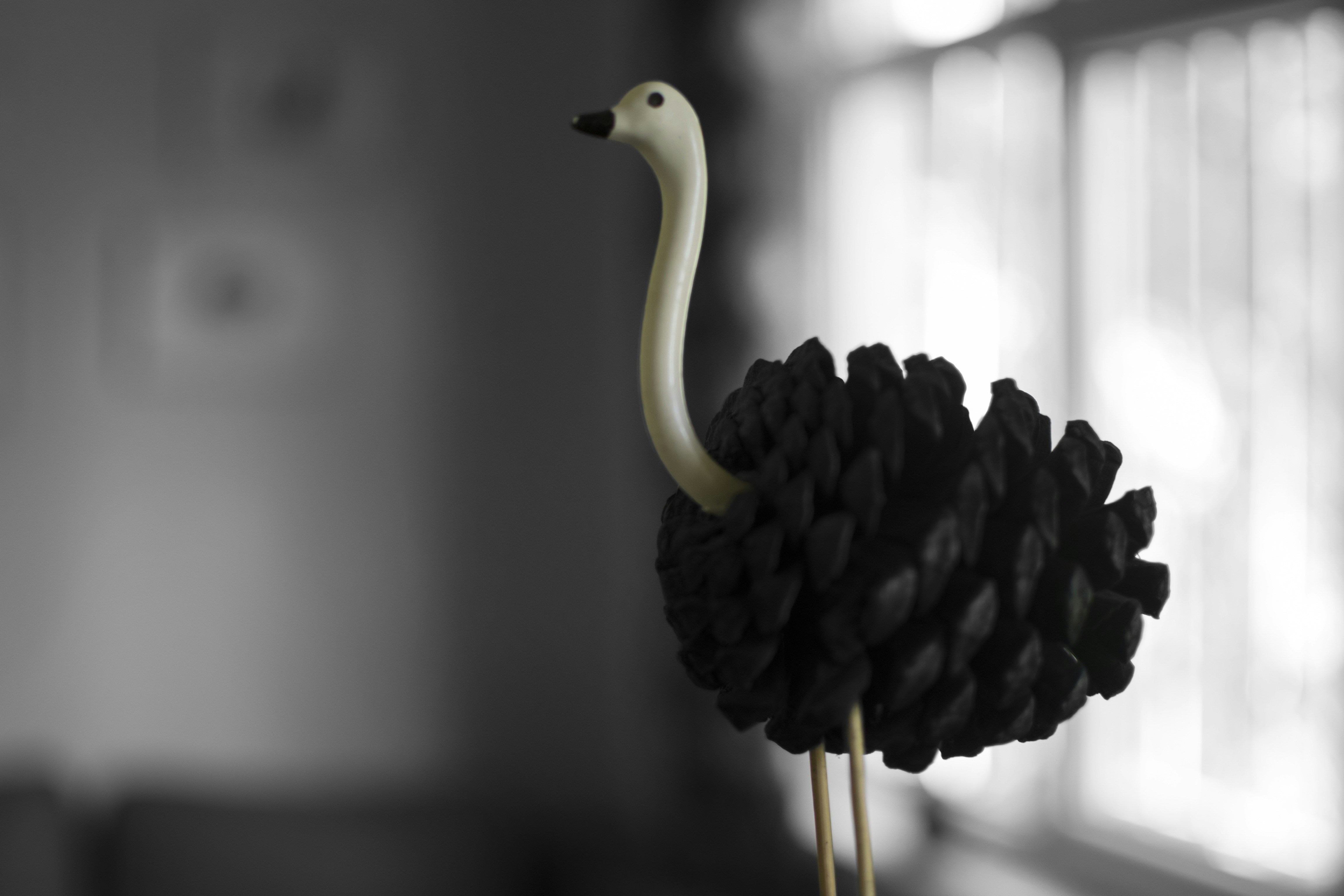 Long-Necked Serenity: A Plush Crane Stands Quietly in Soft Focus