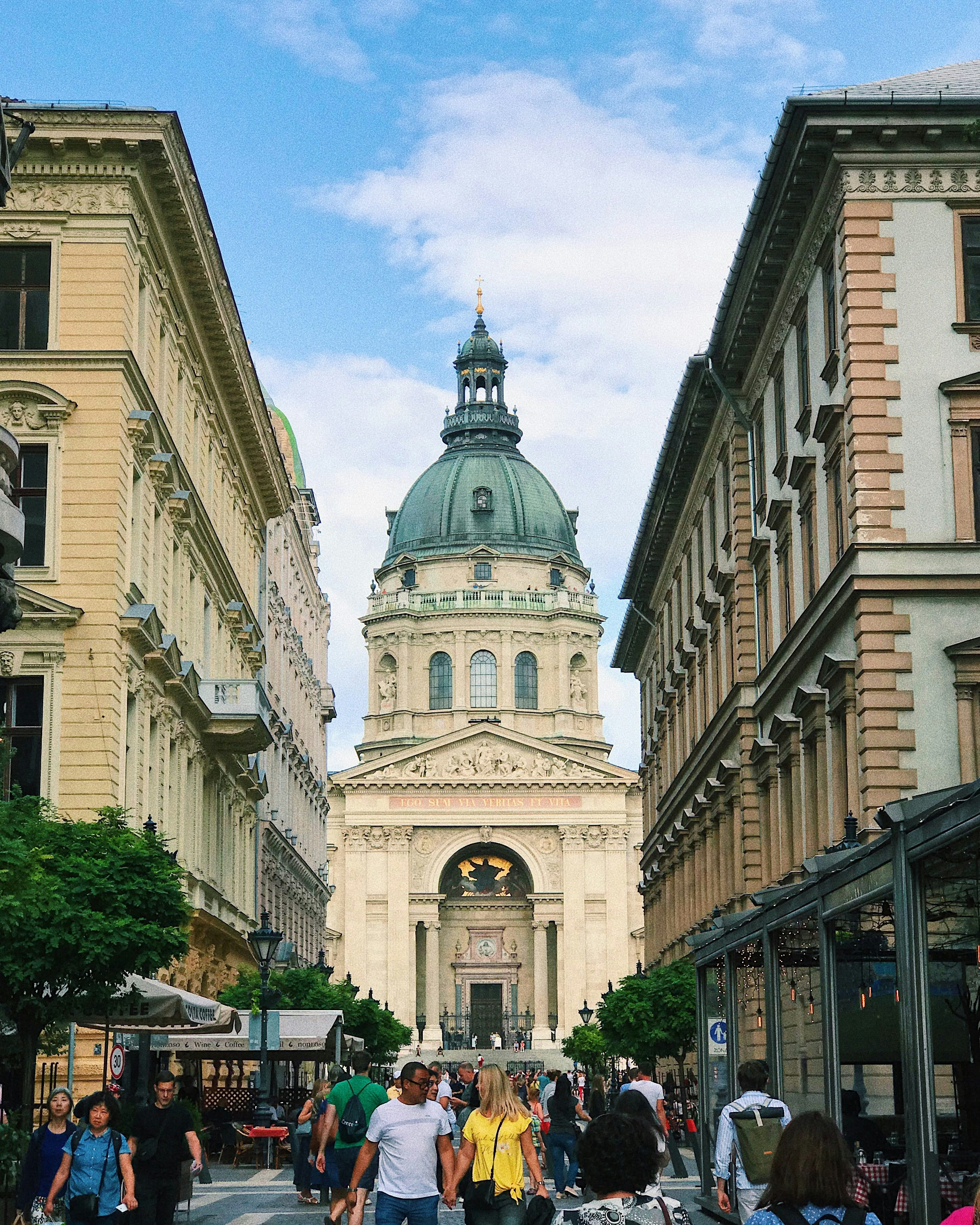 Historic church framed by bustling streets, capturing the essence of city life and architectural beauty.