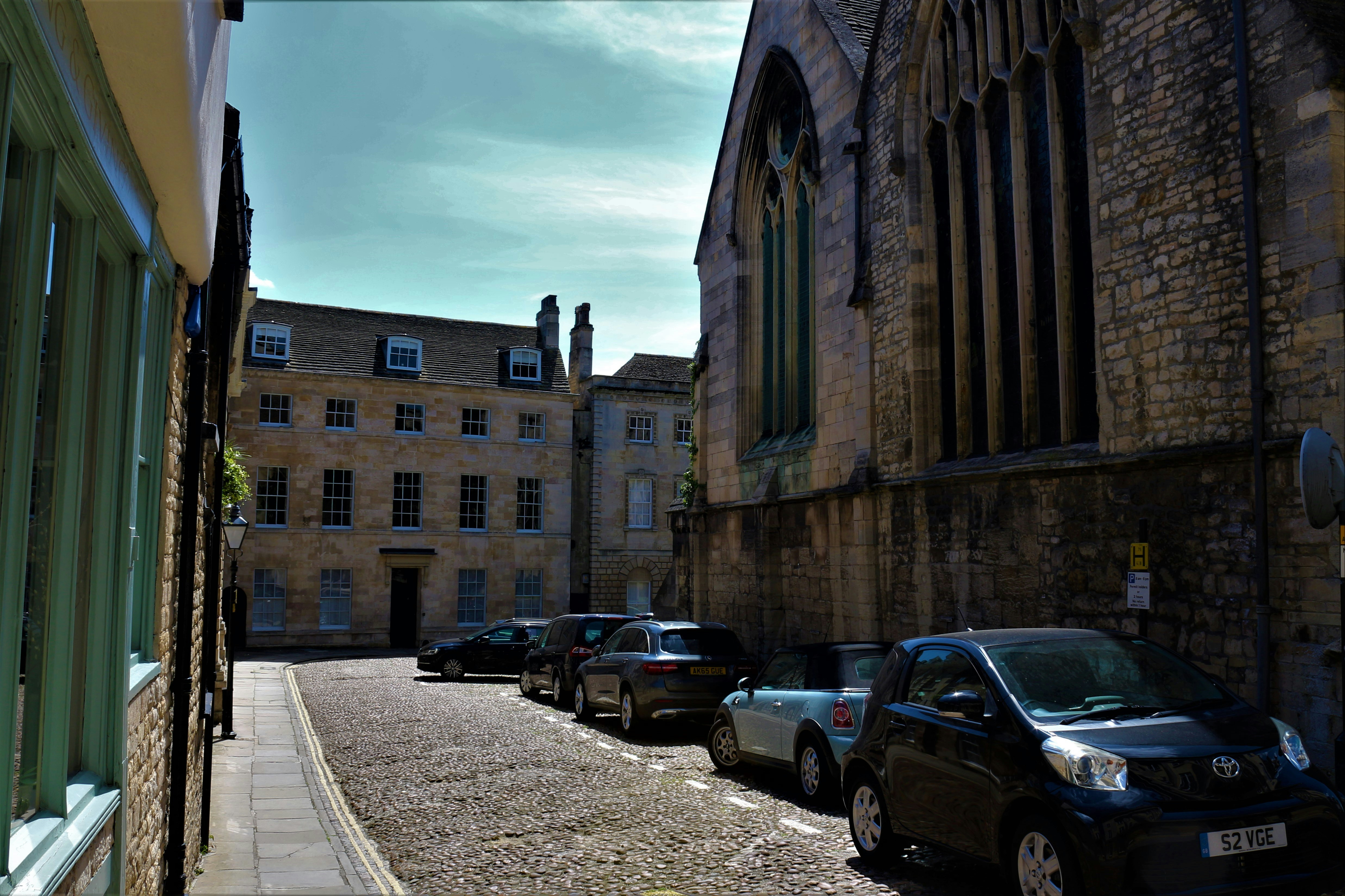 Cobblestone Avenue Toward a Gothic Facade