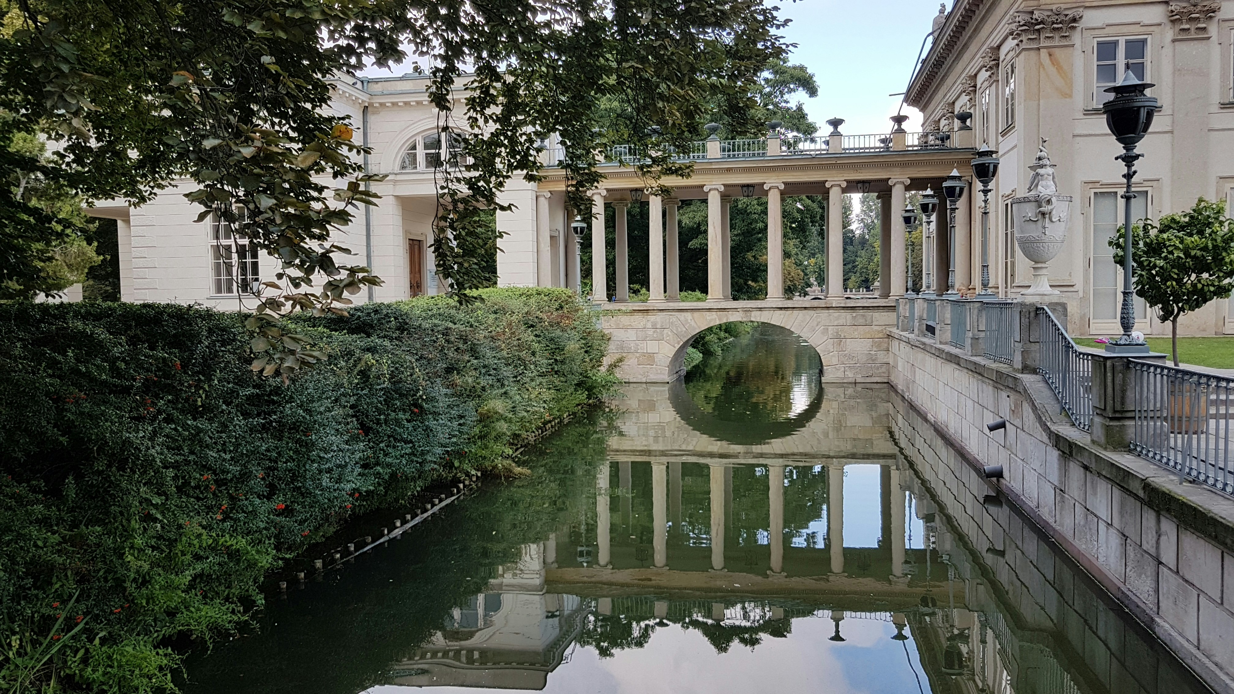 Tranquil Reflection by the Historic Bridge