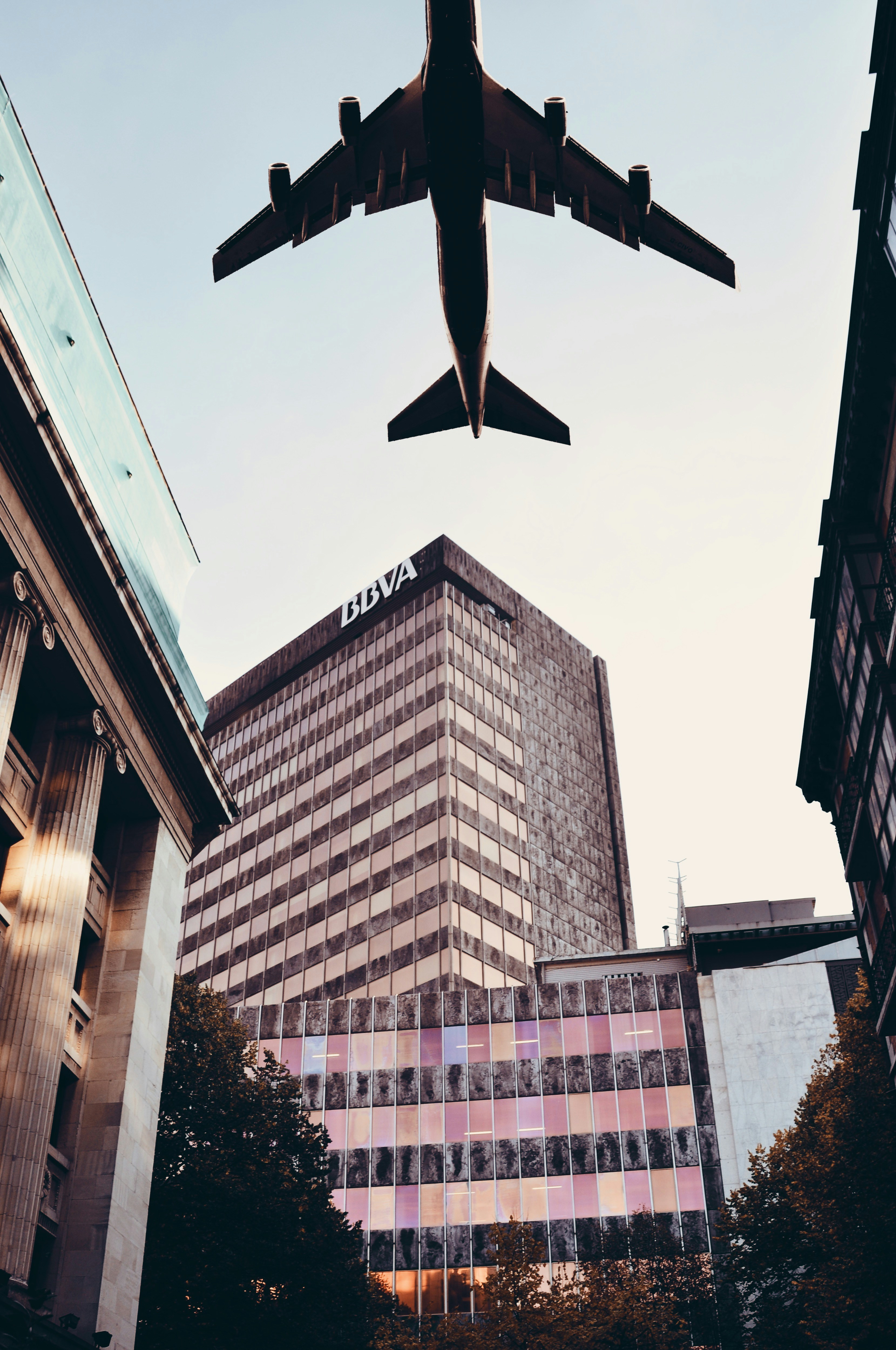 Airplane above buildings photo – Free Aerial photography plane flight ...