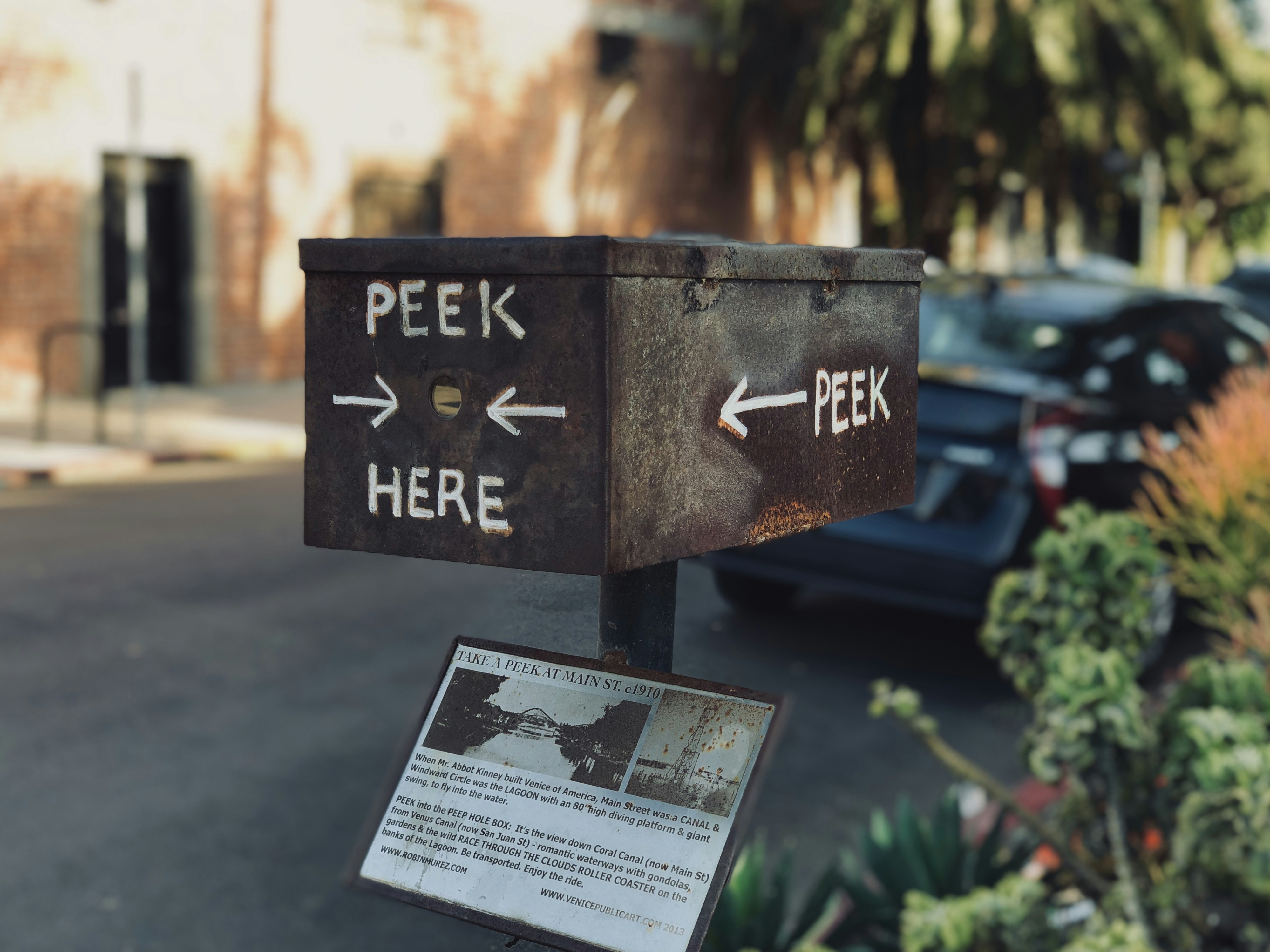 Mailbox with Arrowed Messages: A Quiet Parking Lot Moment