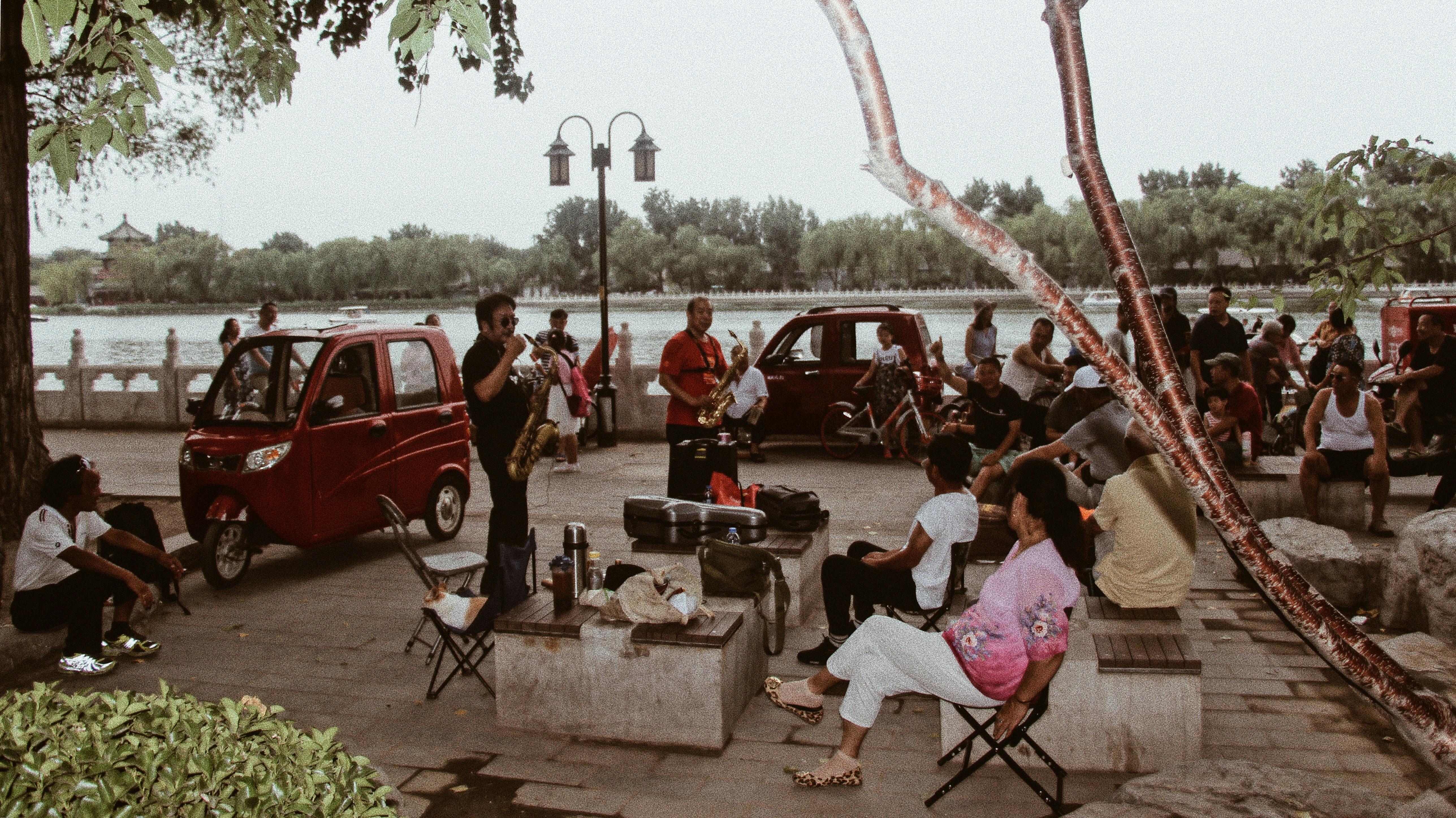 Riverside Rendezvous: A Candid Crowd by the Water