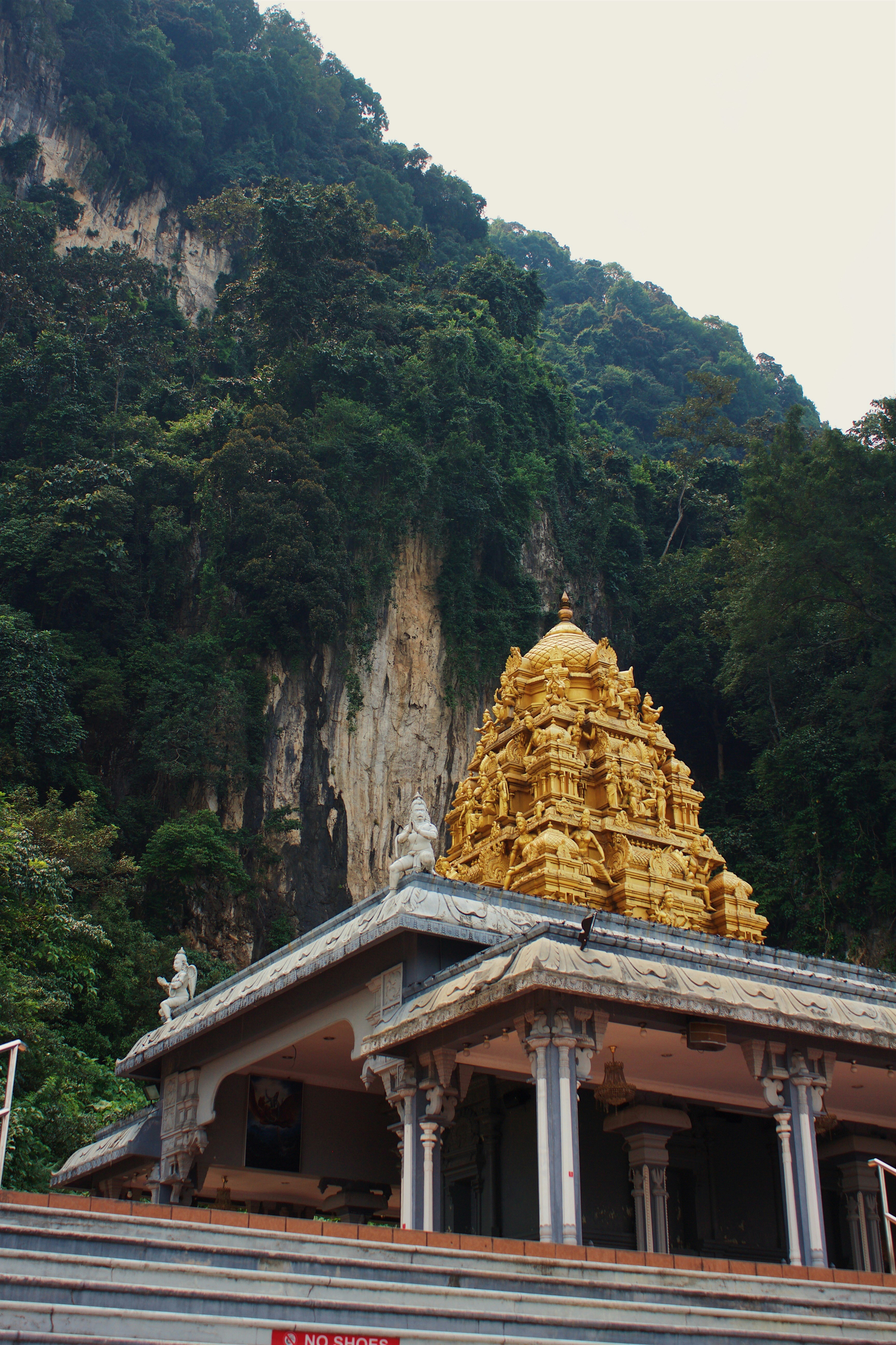 gold building beside mountain during day