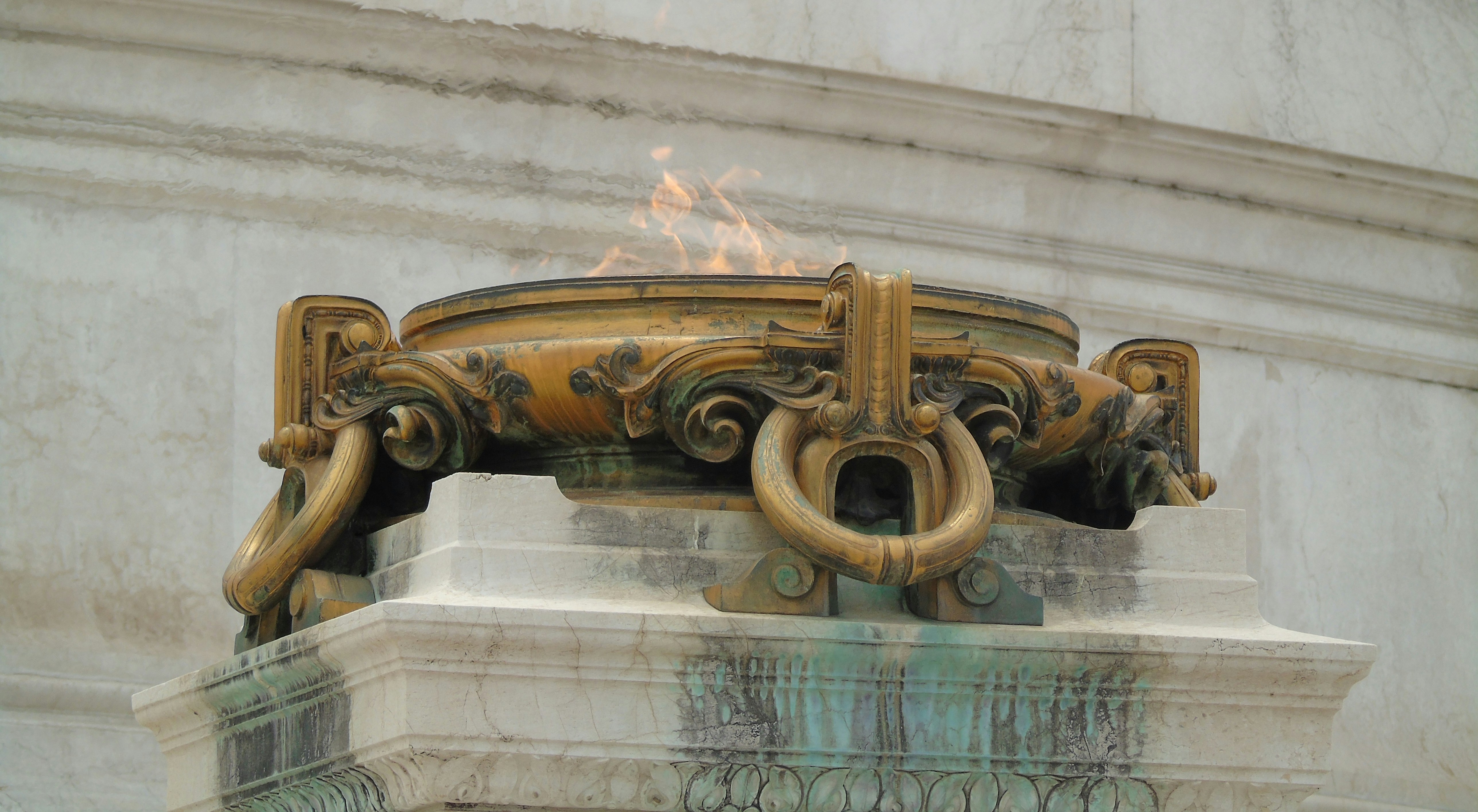 Flaming Ringed Torch on a Weathered Pedestal