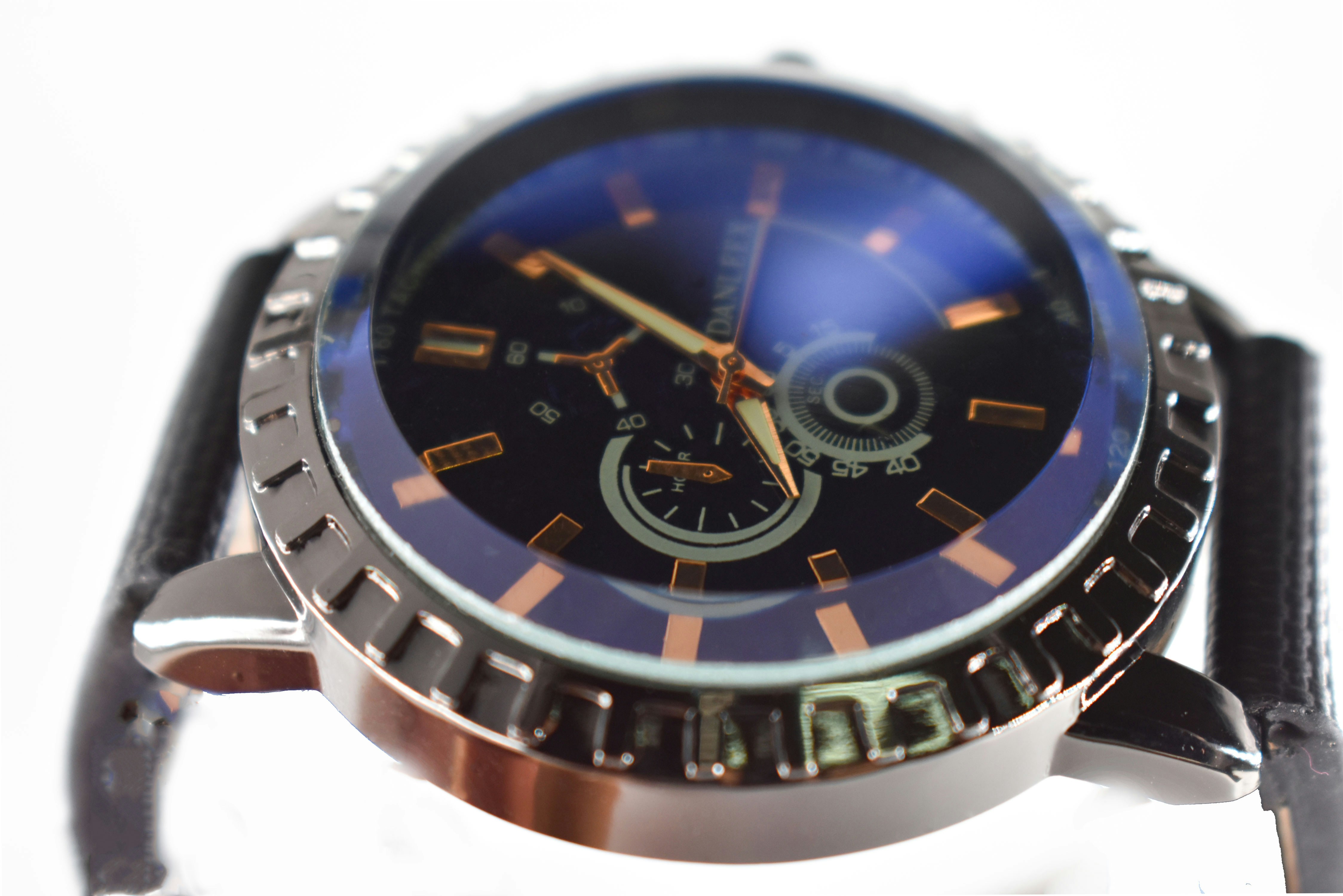 Close-Up of a Metallic Wristwatch with blue Dial and Subdials
