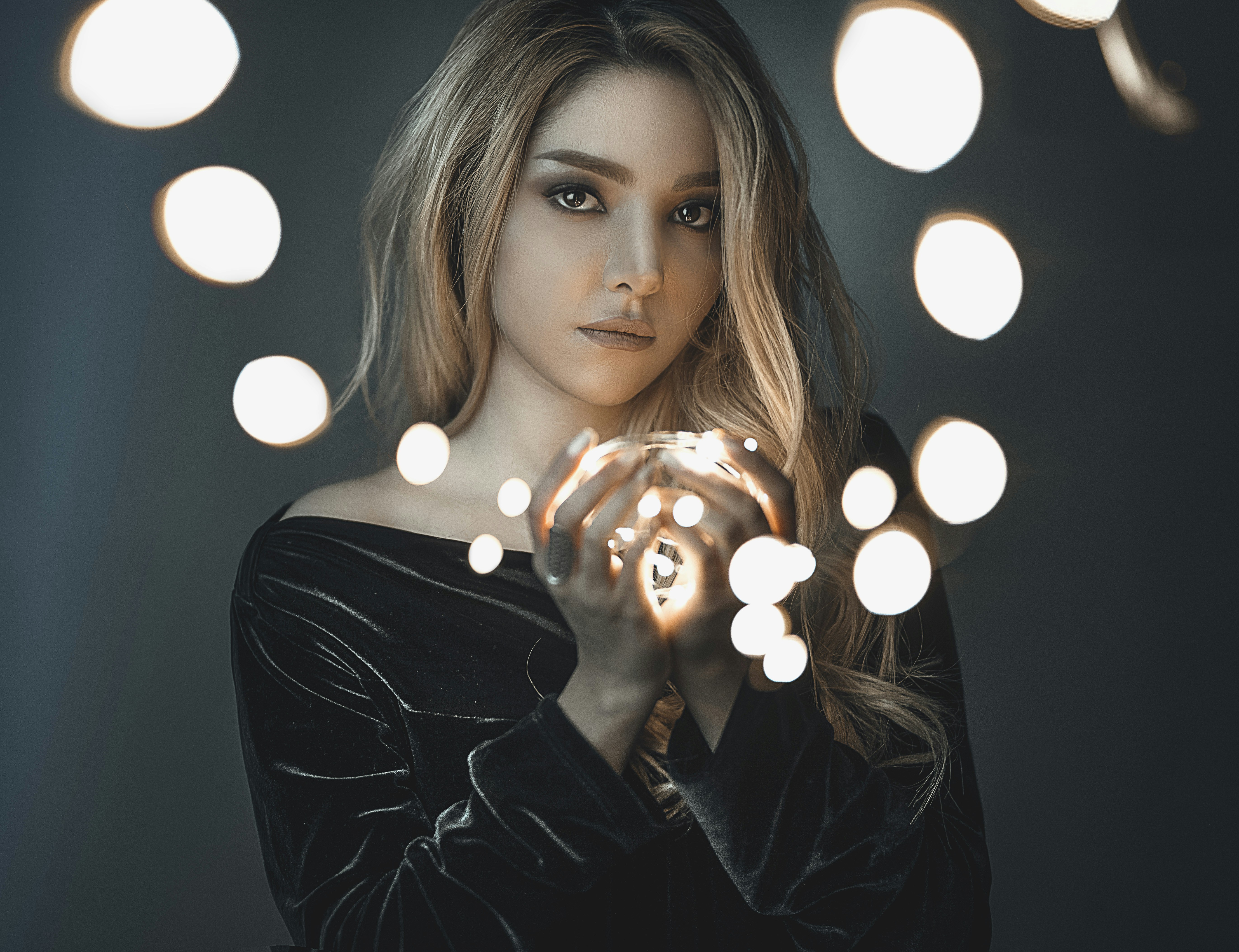 Woman holding string LED light photo – Free Grey Image on Unsplash