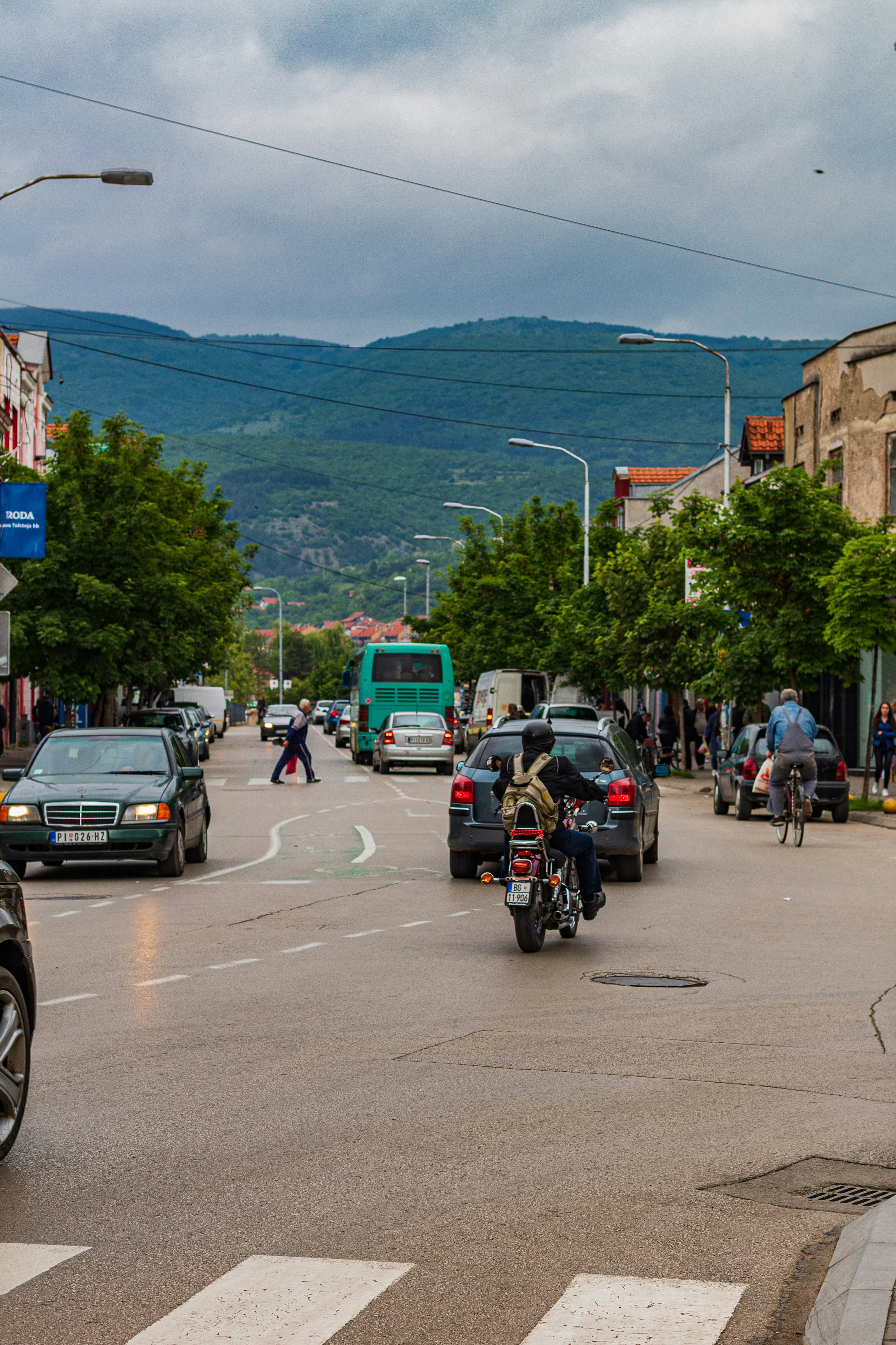 City Street Pulse: Motorcycle in the Midday Traffic