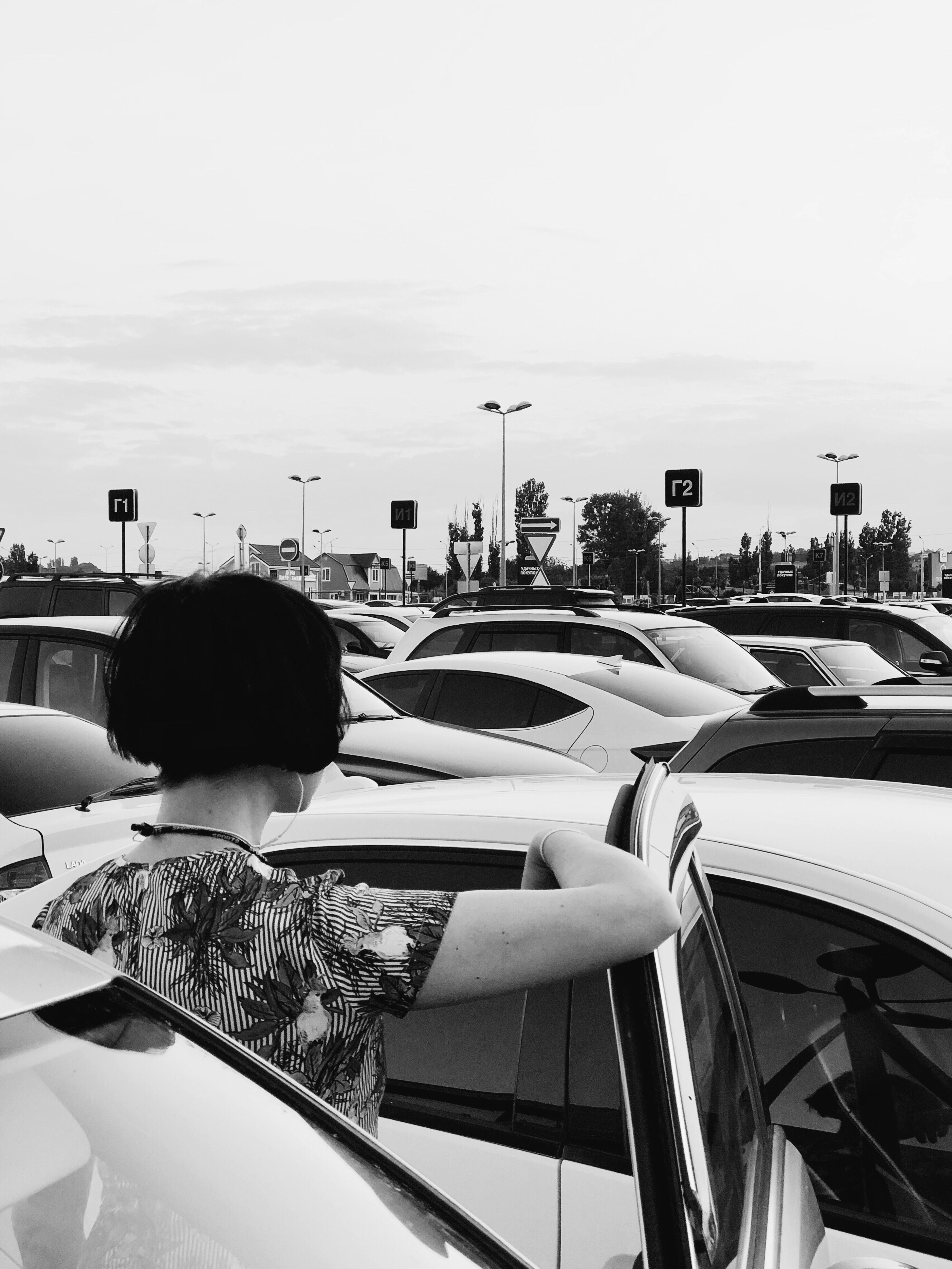 man standing near car
