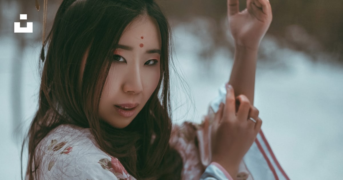 Woman In Brown And White Floral Dress On Selective Focus Photography