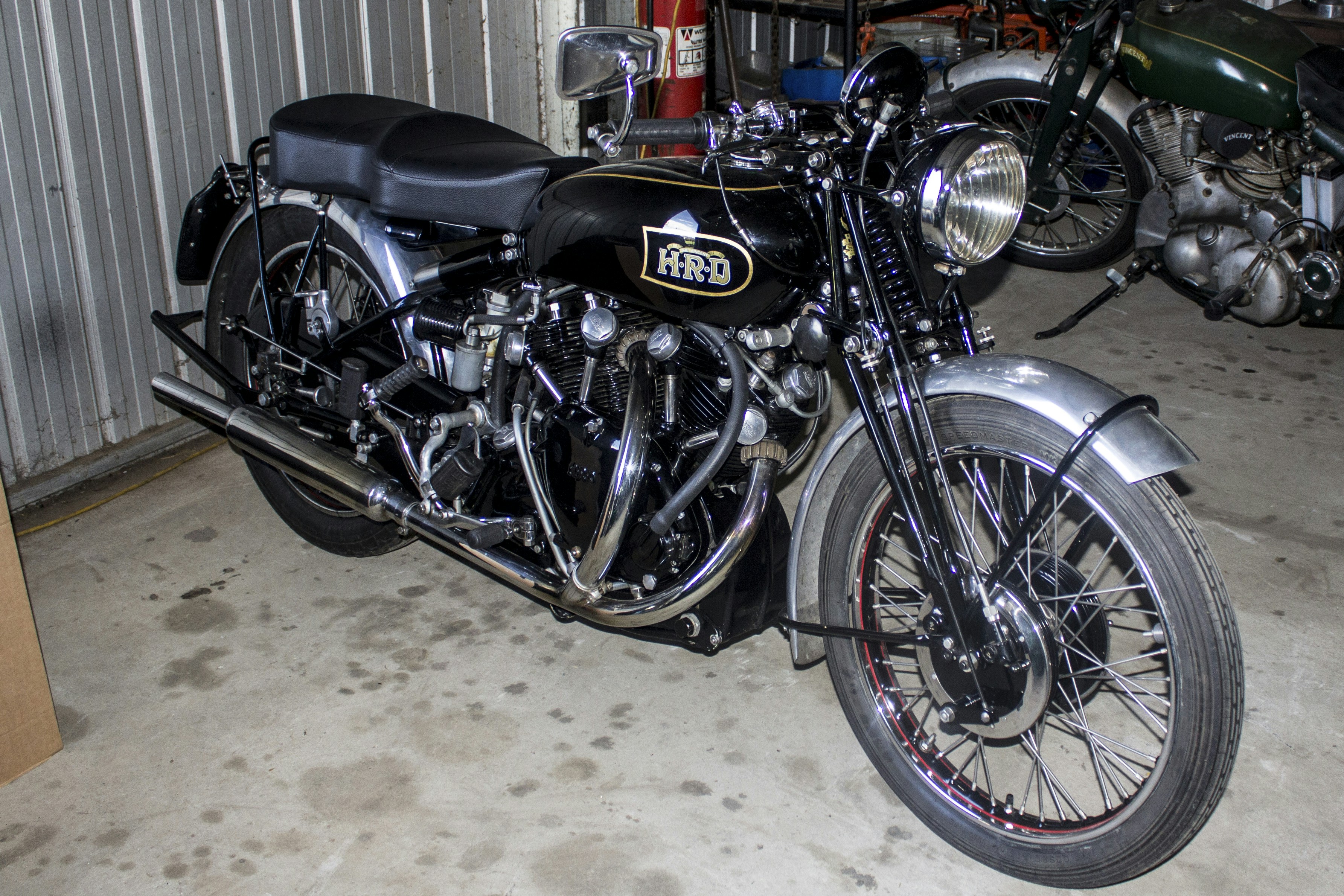 Black classic HRD motorcycle in garage photo – Free Vincent Image on ...