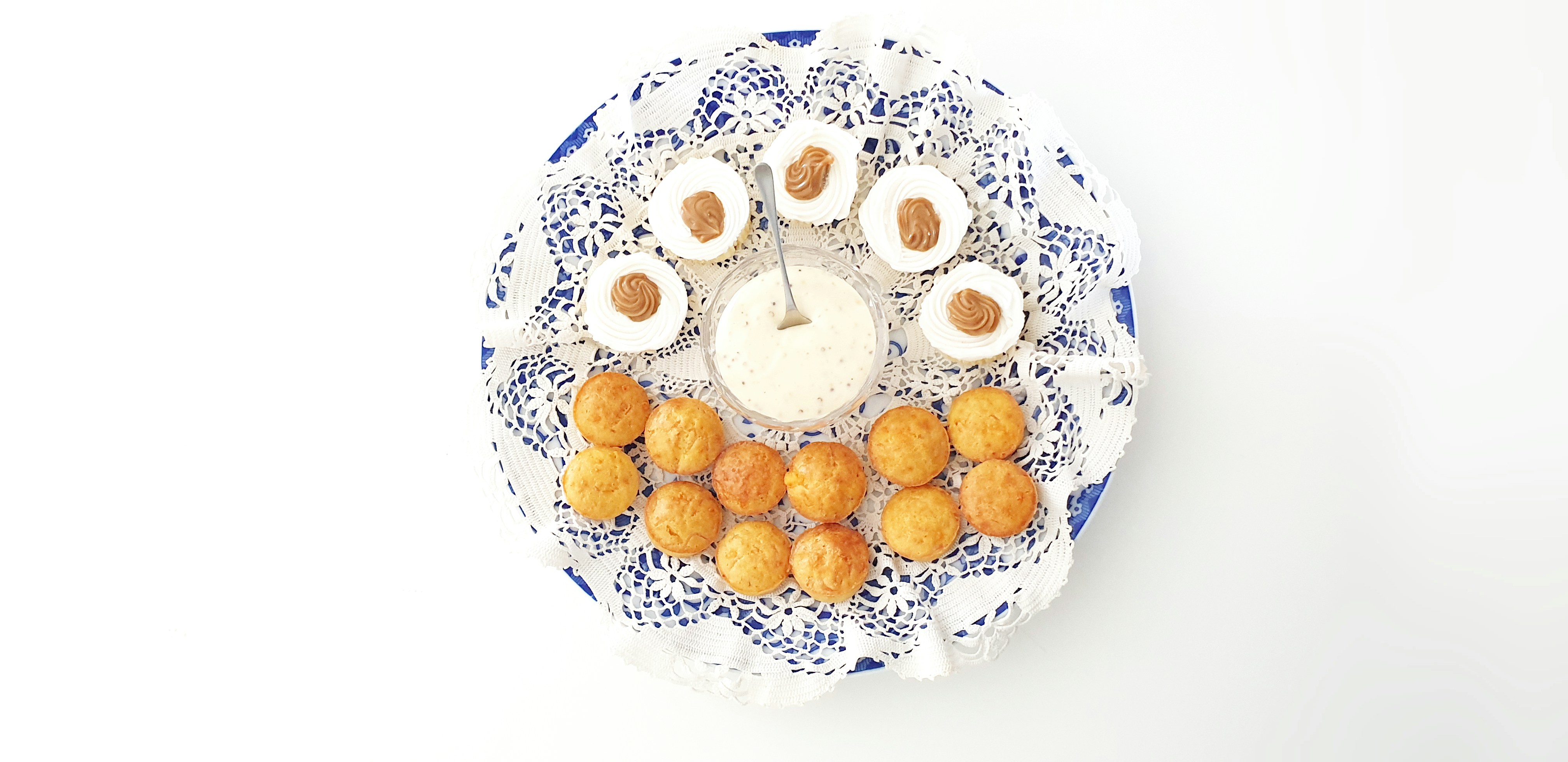 Candlelit Centerpiece: Lace Doily Framing a Ring of Pastries