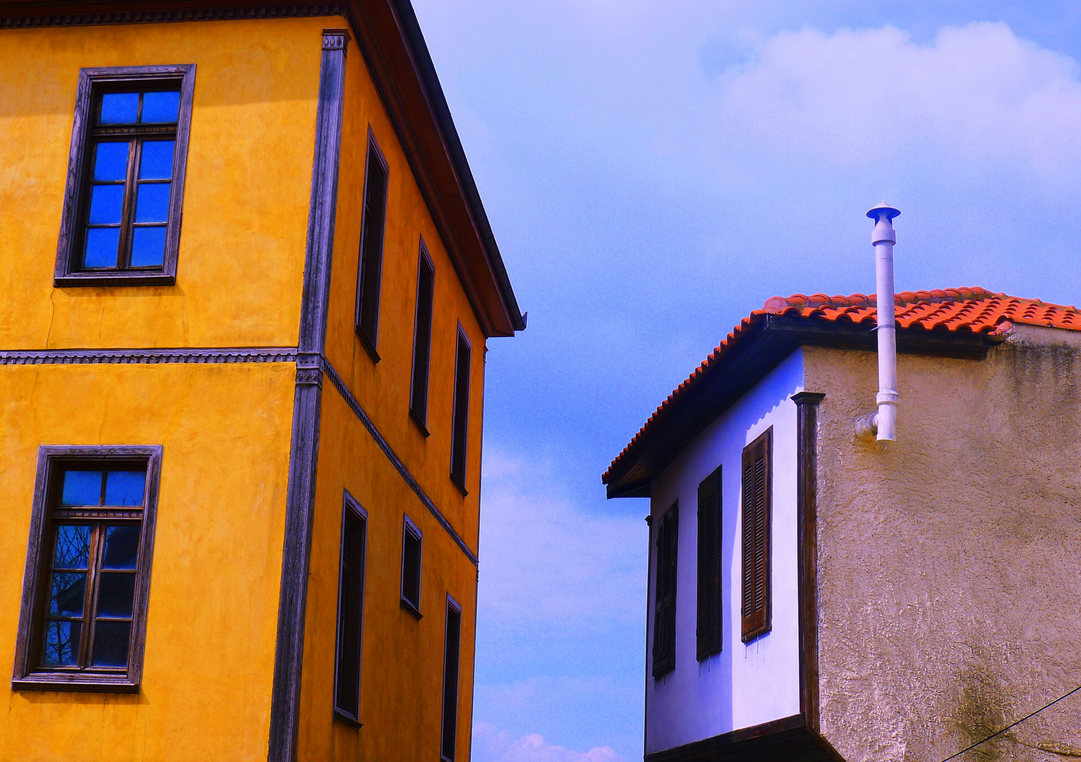 two buildings under cloudy sky